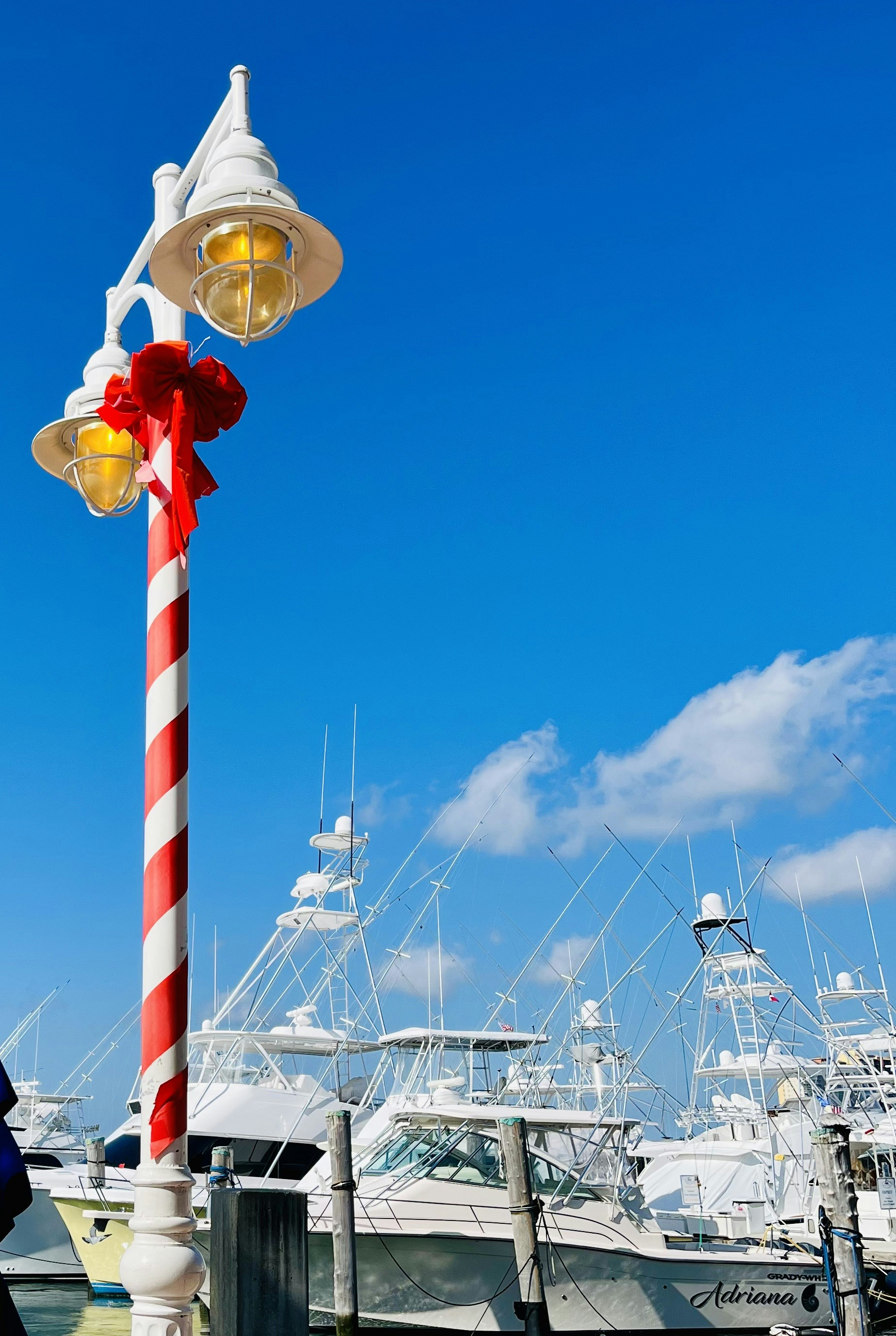 Candy-Cane Lantern Over a Quiet Marina