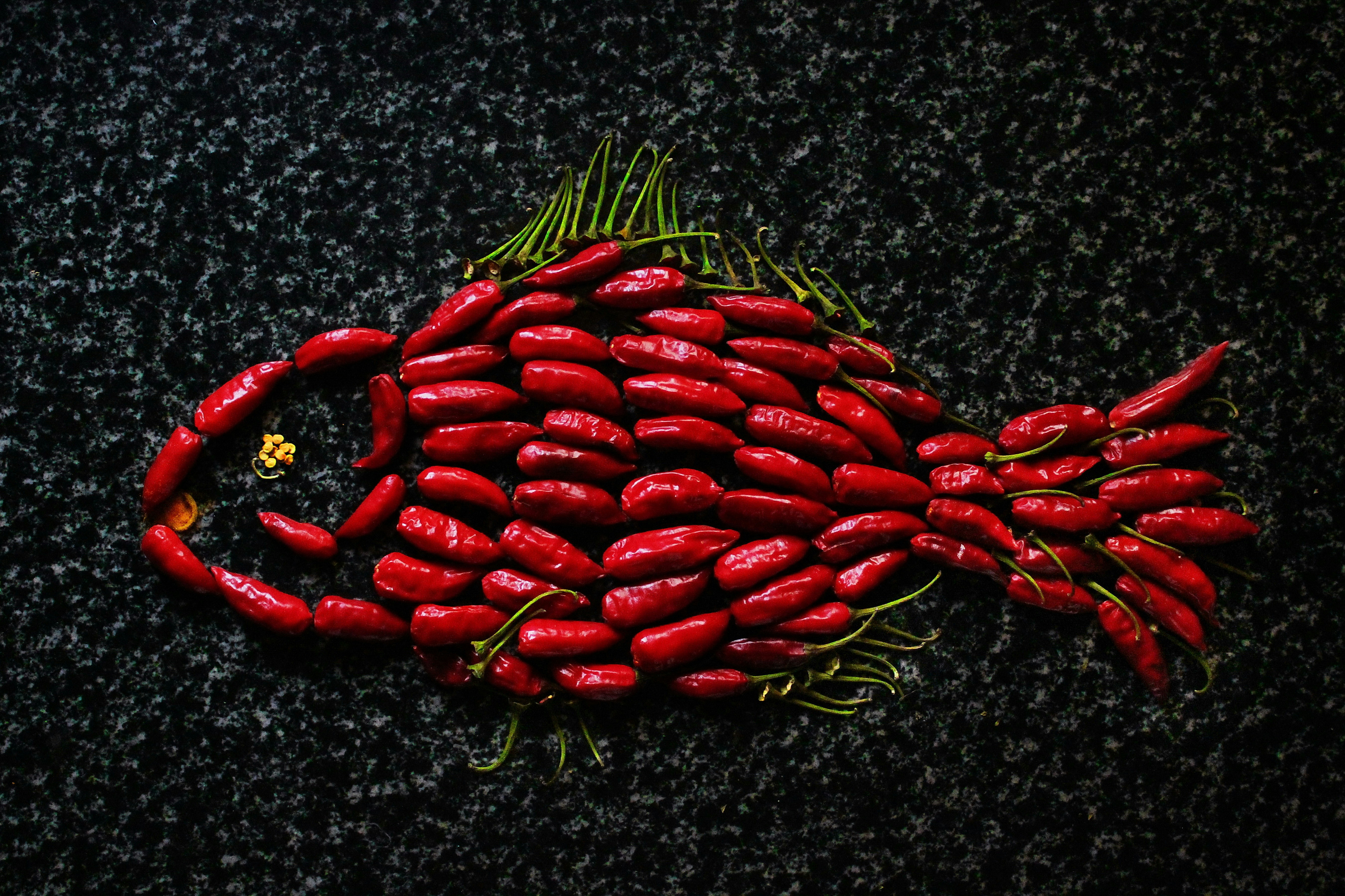 Crimson Curve on a Midnight Granite