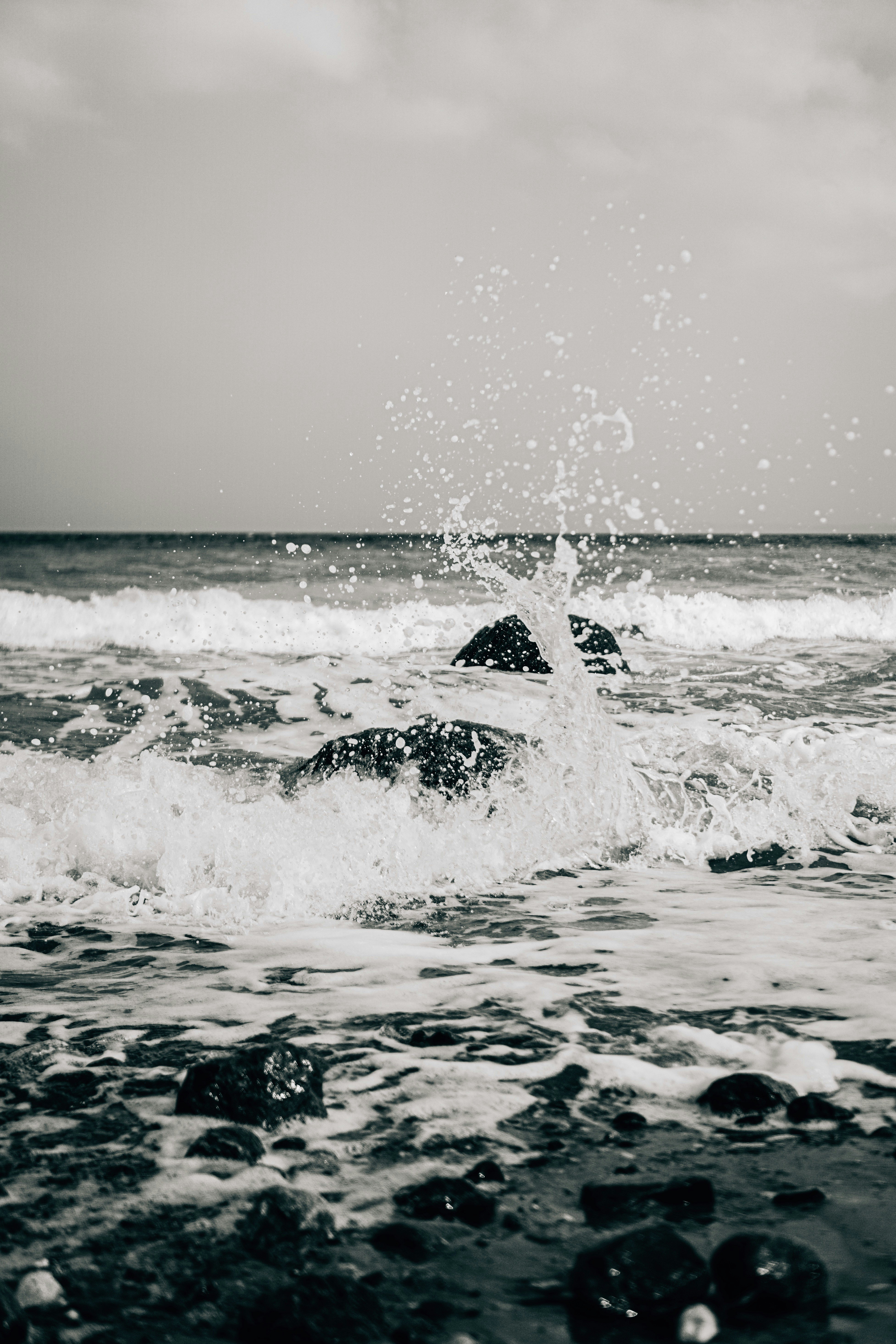 Rogue Wave Breaks Over Hidden Rocks at the Shore