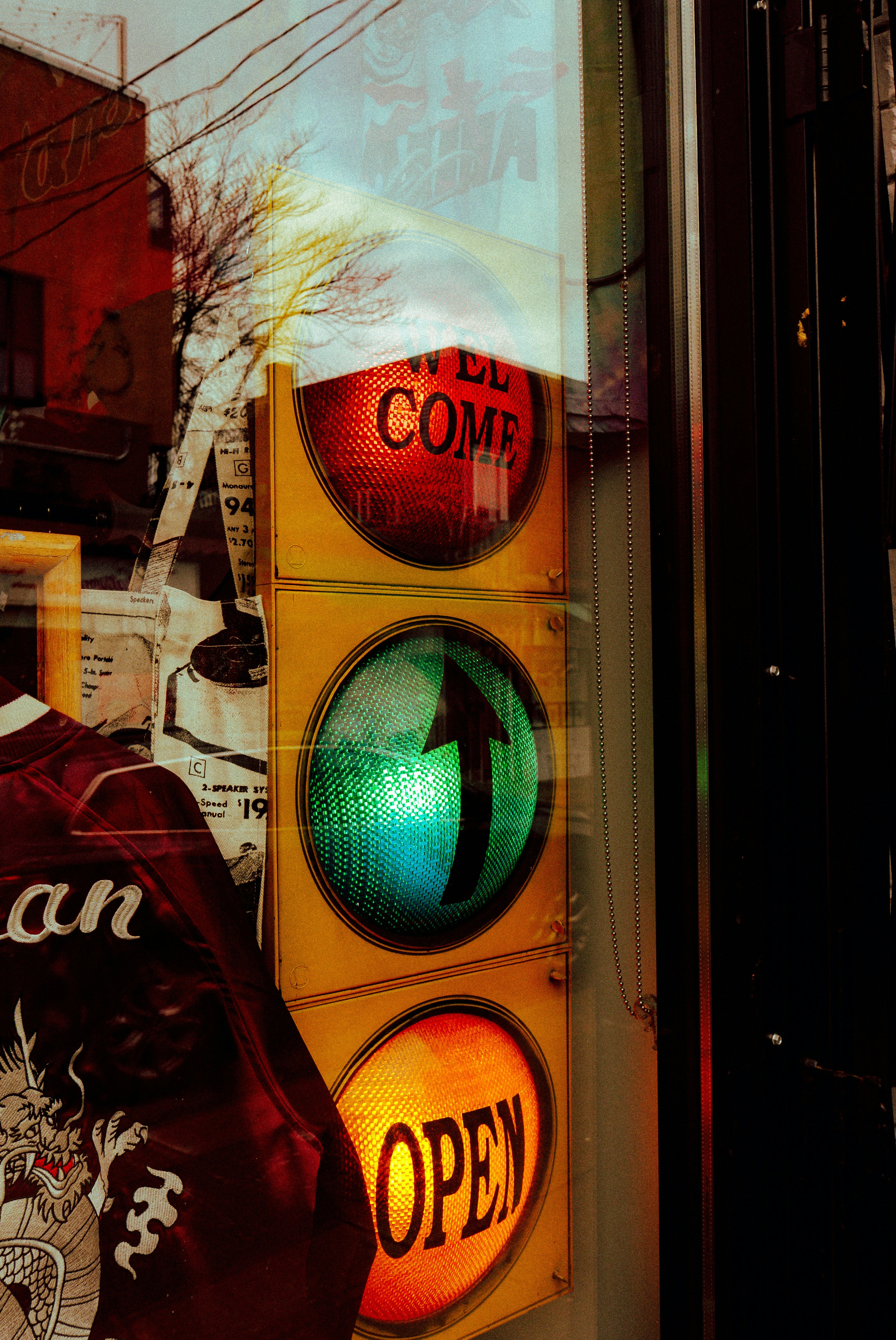 Green Arrow Window: A Street-Sign Portrait in Glass and Reflections