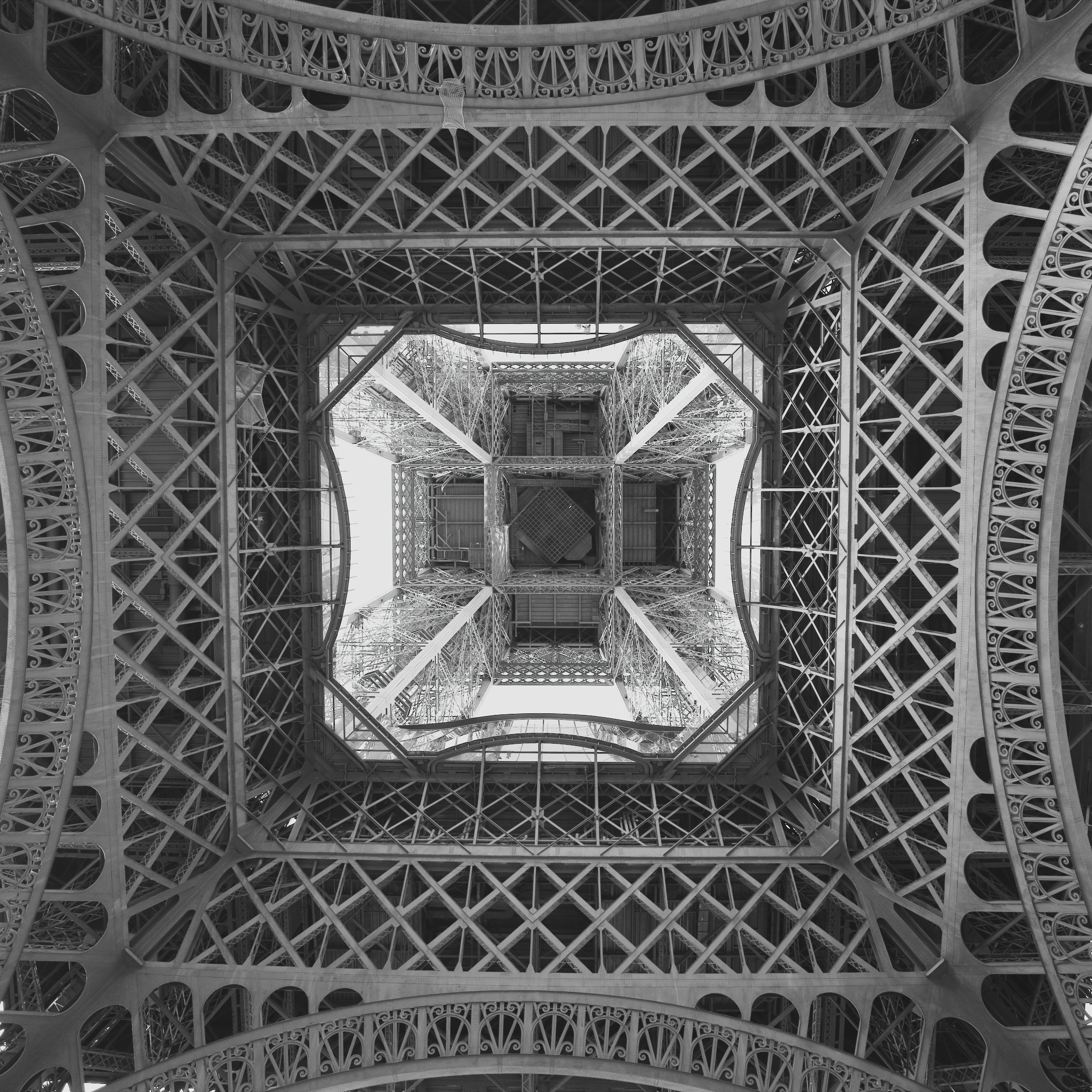 Architectural Vortex: Looking Up from the Eiffel Tower’s Core