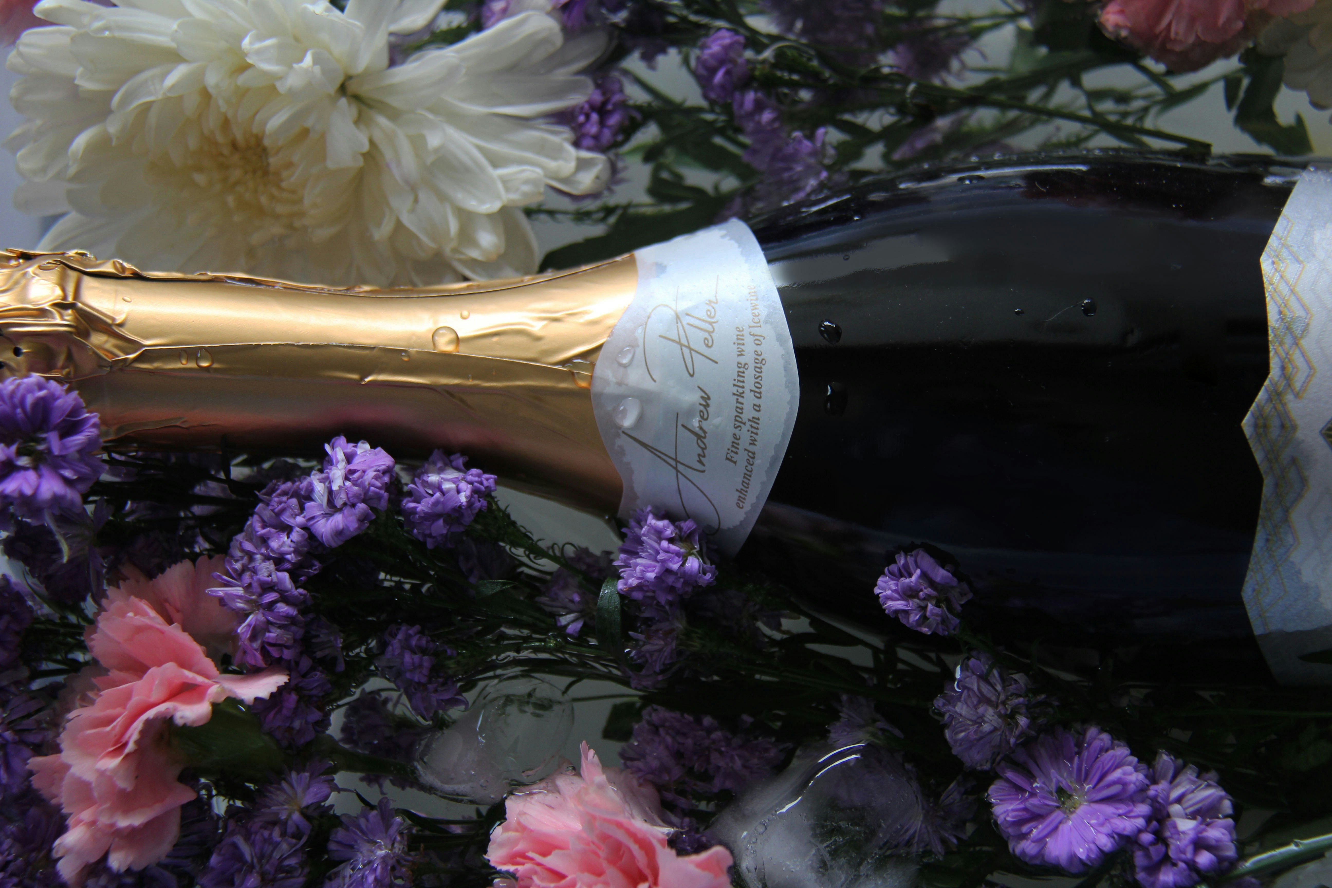Gilded Neck, Velvet Bloom: Champagne Lie Among Purple Petals