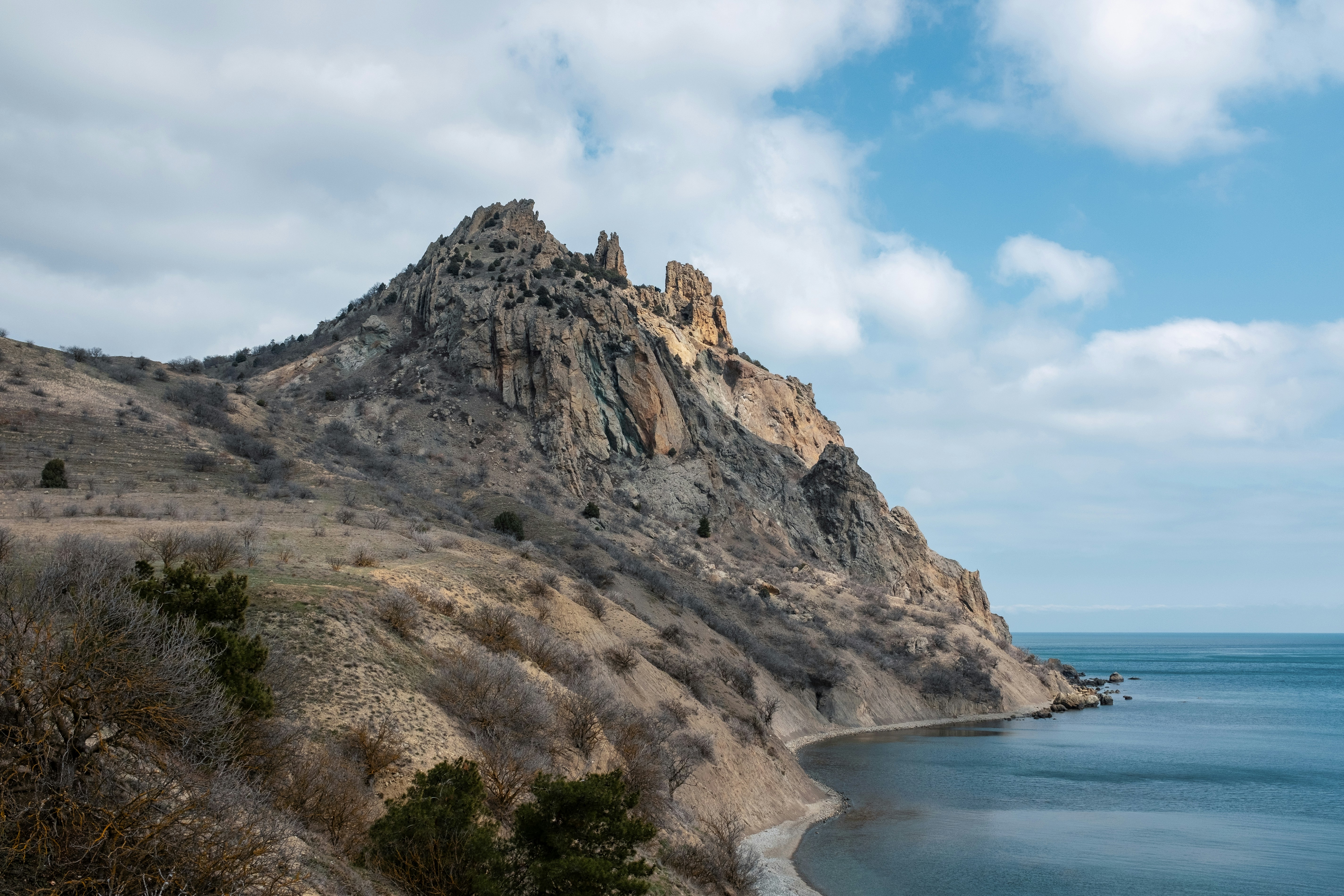 Granite Sentinel Over a Quiet Coastal Sea