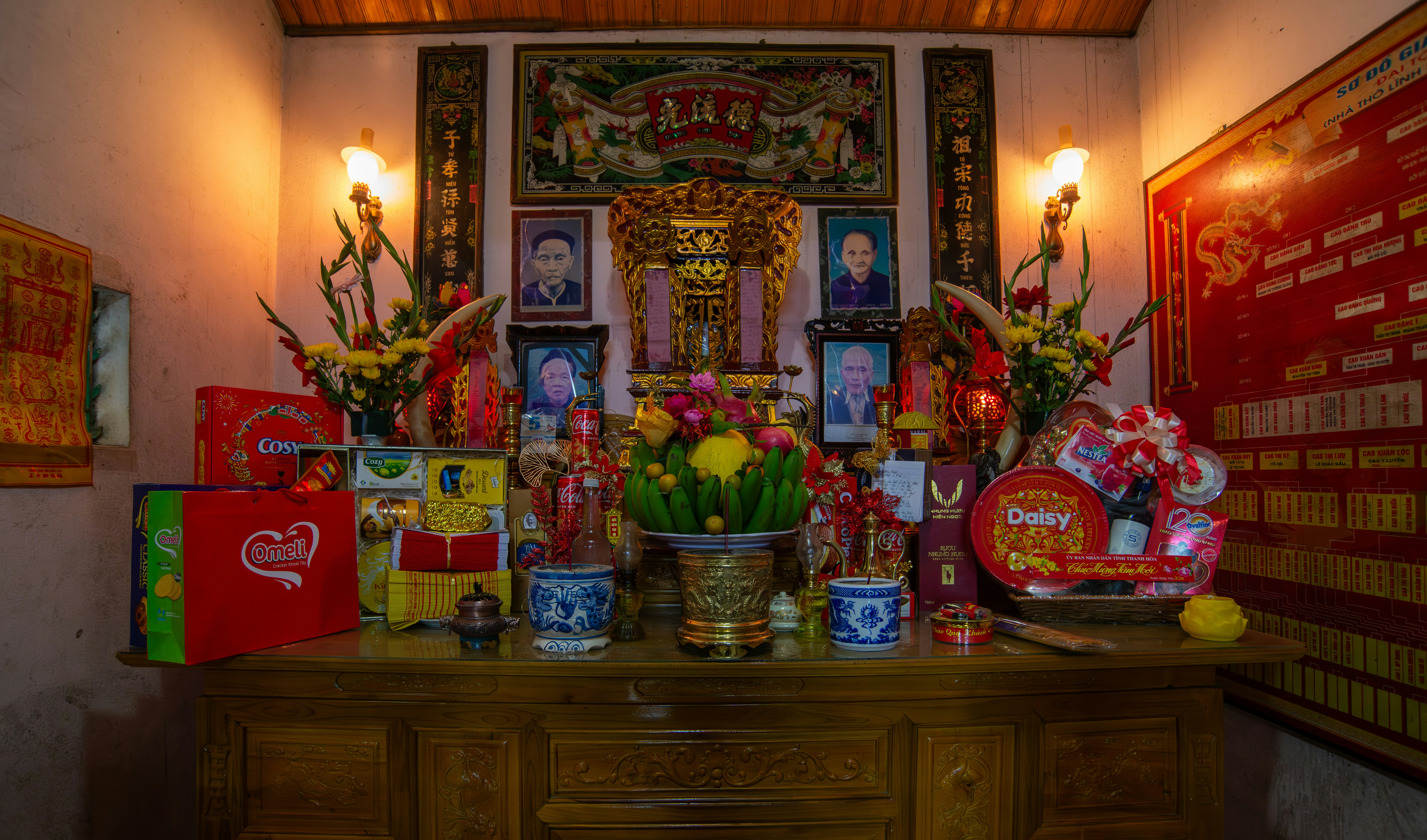 Golden Altar in Amber Glow: Portraits, Offerings, and Fruit at a Household Shrine