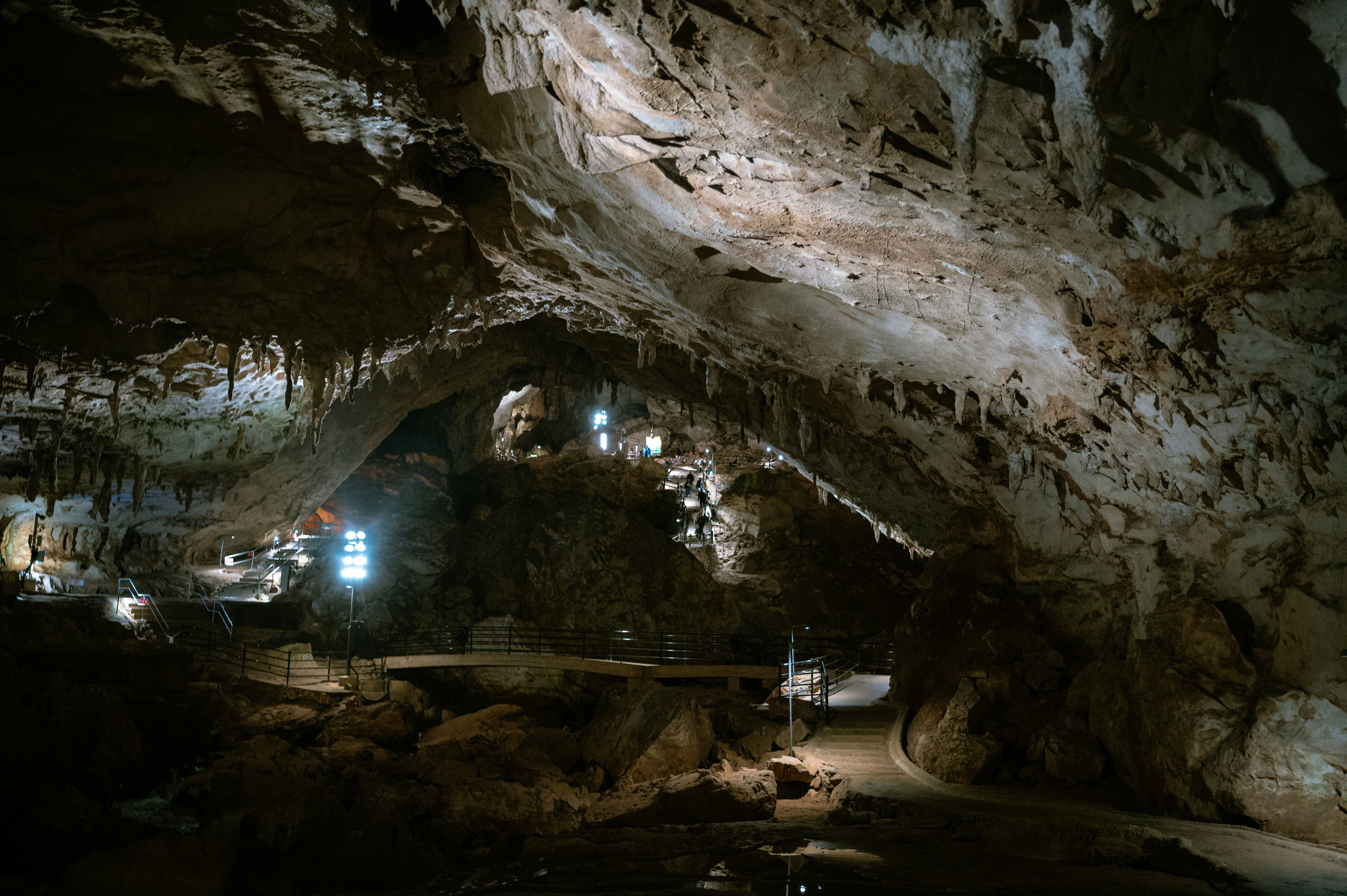 A cave filled with lots of cave like structures photo – Free Cave Image ...