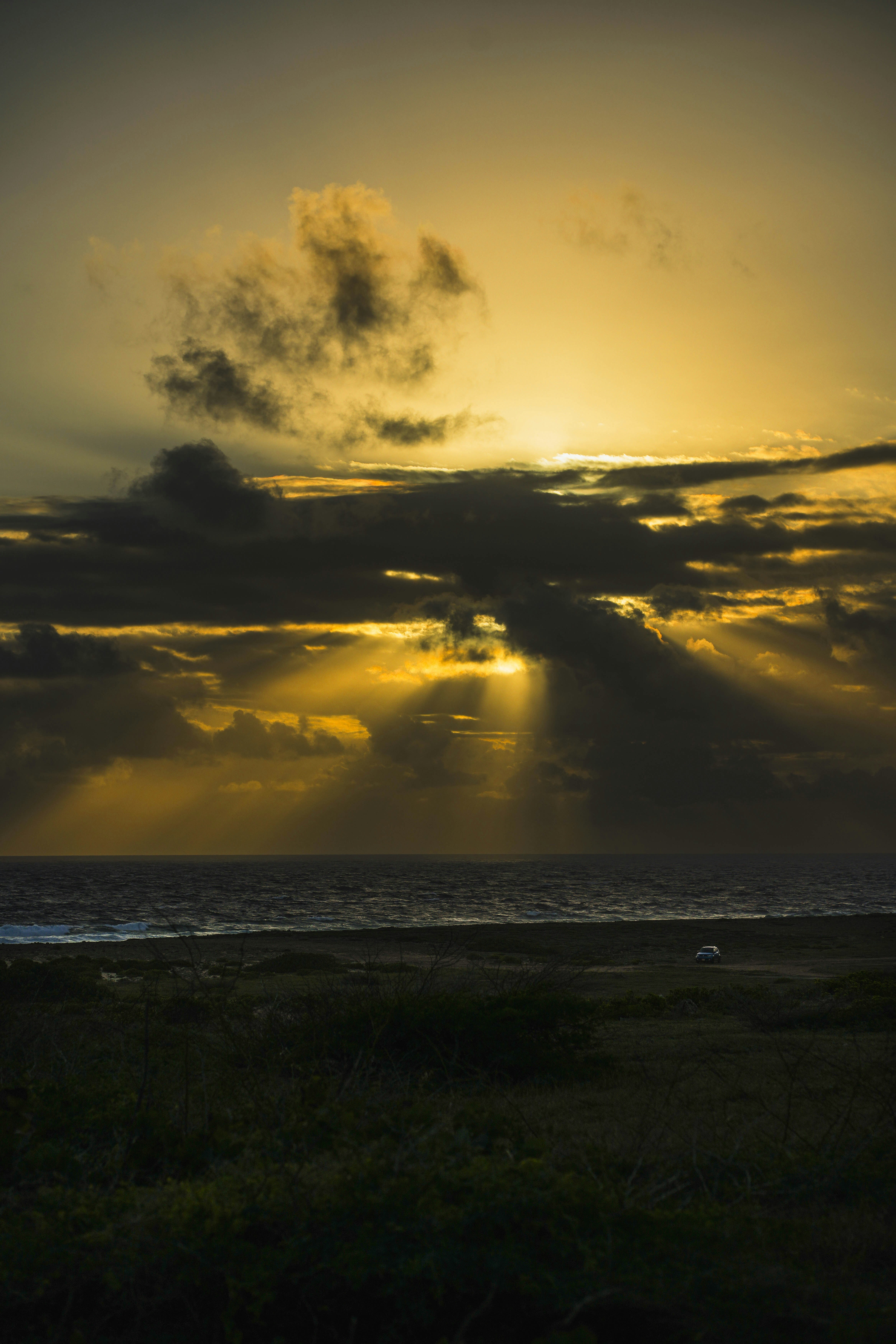 Rays Through a Cloudbreak Over a Quiet Coastal Evening