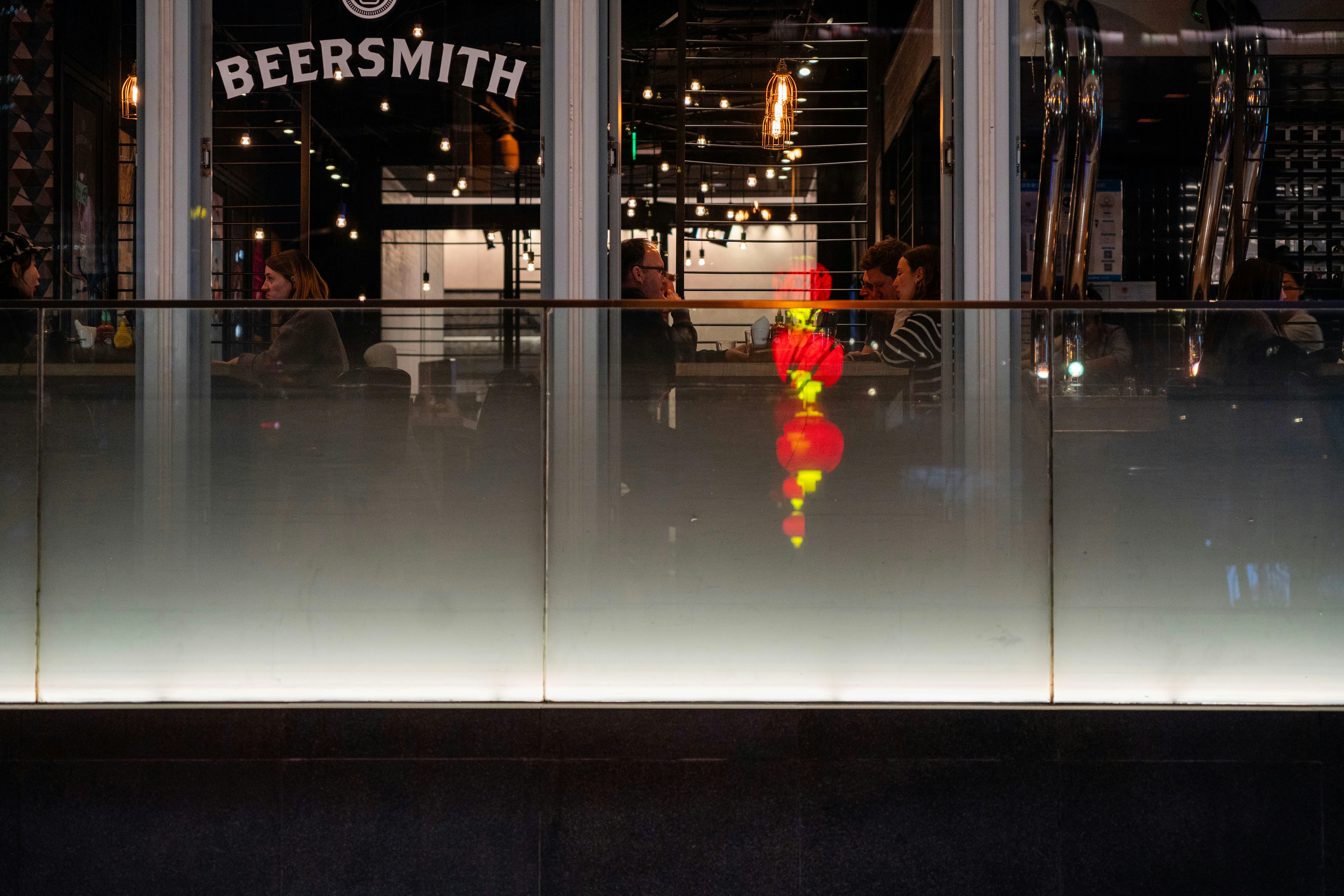 Beersmith Neon on a Glass Rail: Nightlife Reflections