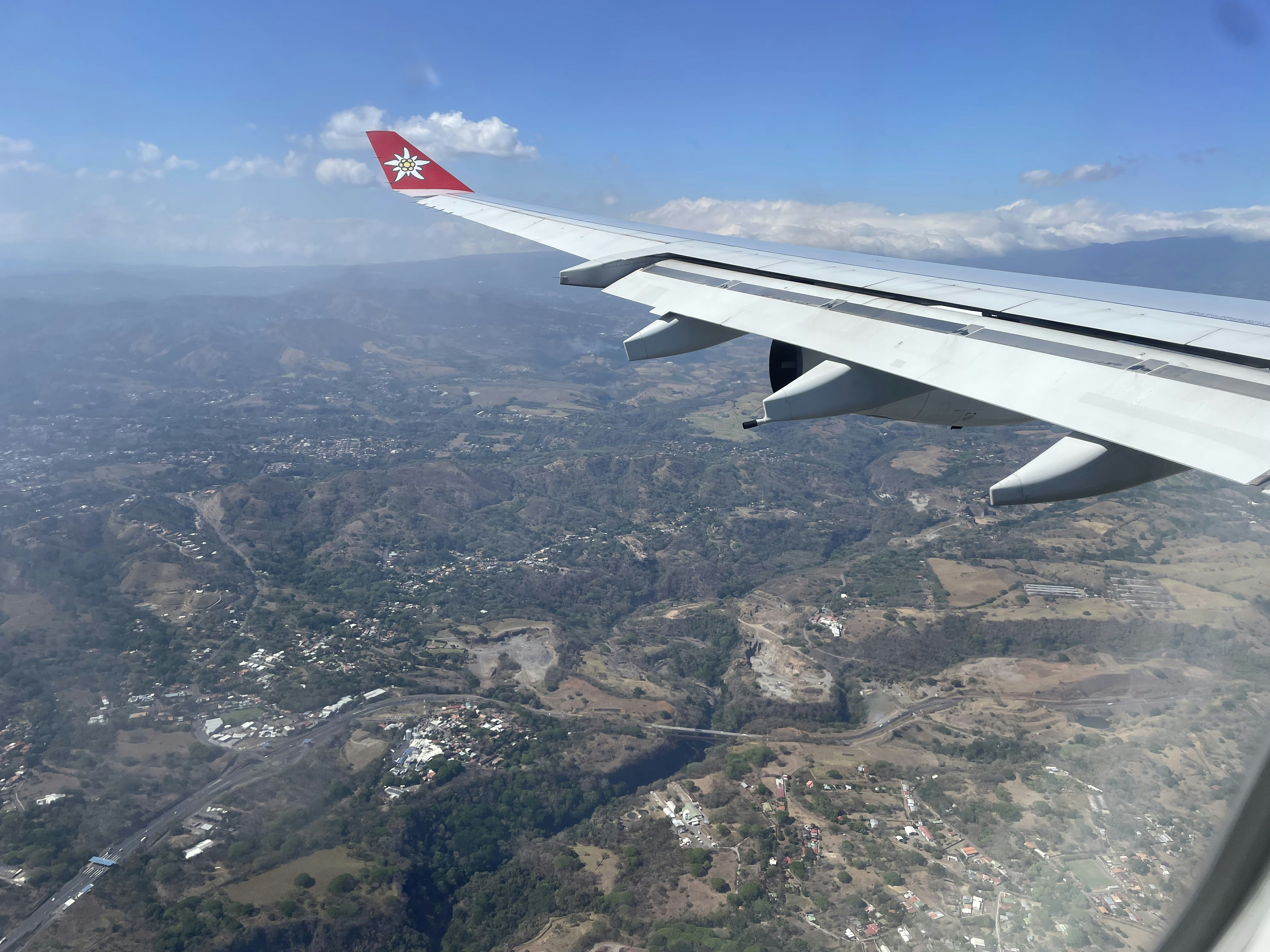 Sunlit Wing and Patchwork Valleys: A Window Seat Panorama
