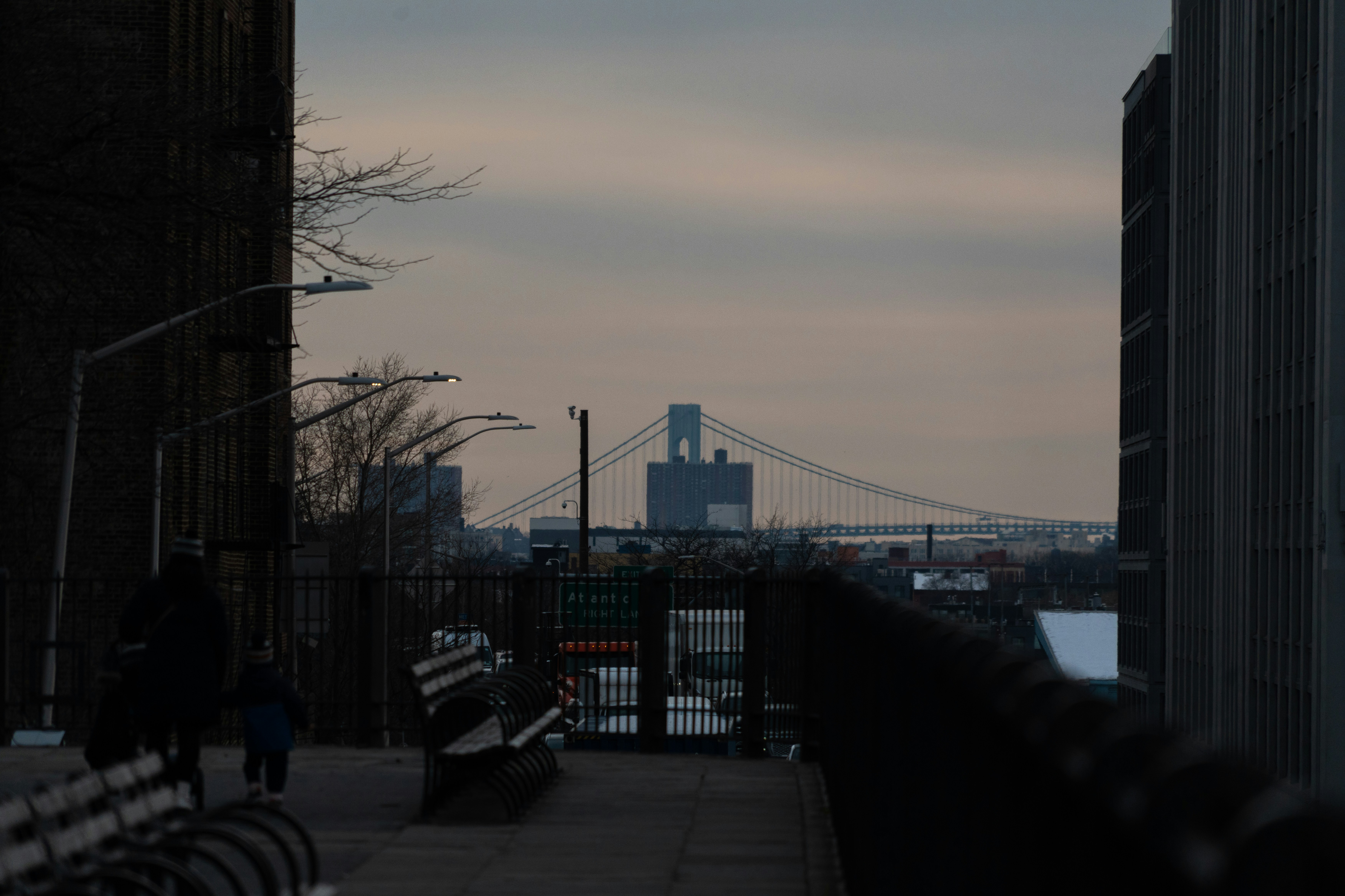 Twilight Over the Riverside: A Quiet Walk Toward the Distant Suspension