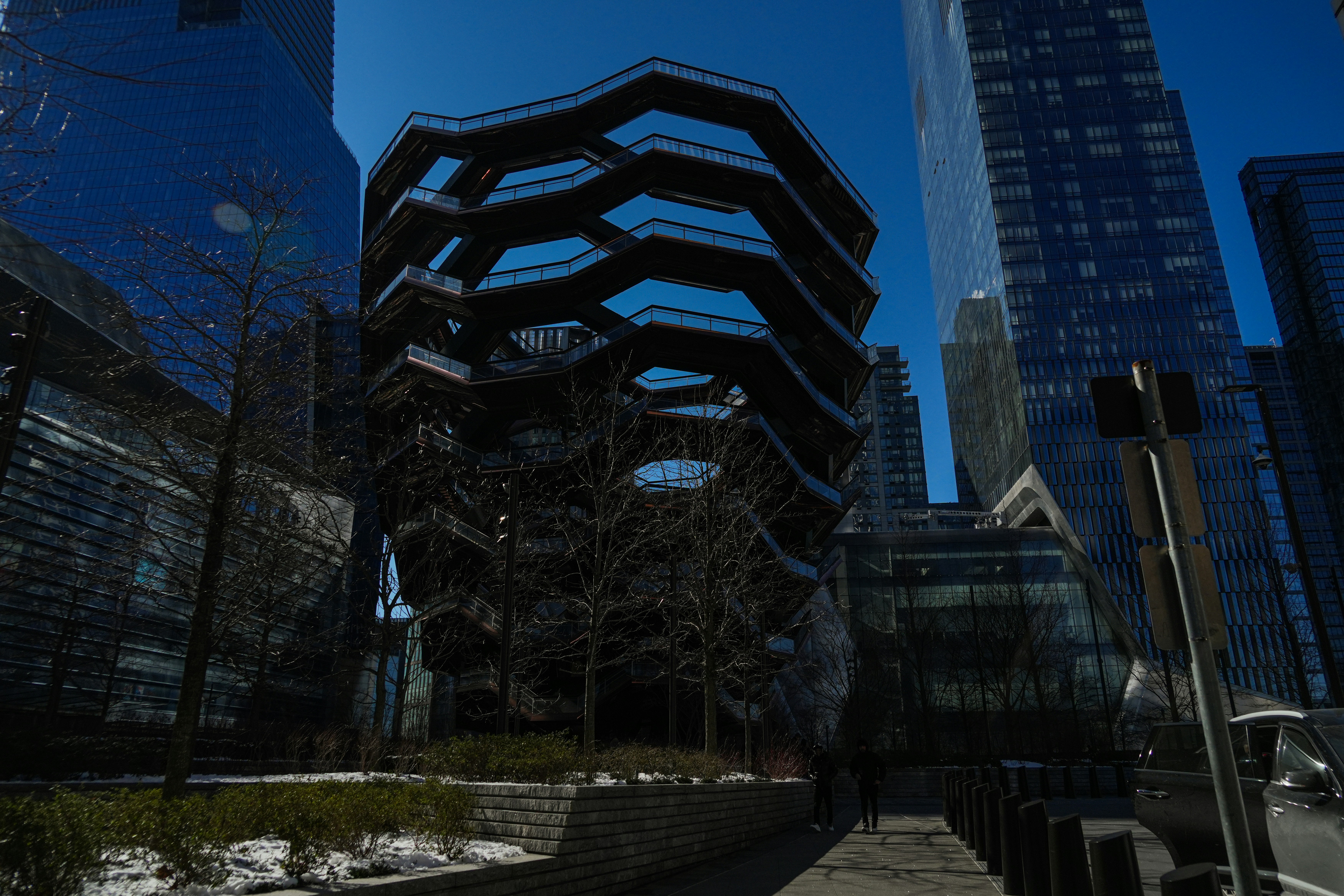 Hexagrid in the City: A Towering Staircase of Steel amid Modern Skyscrapers