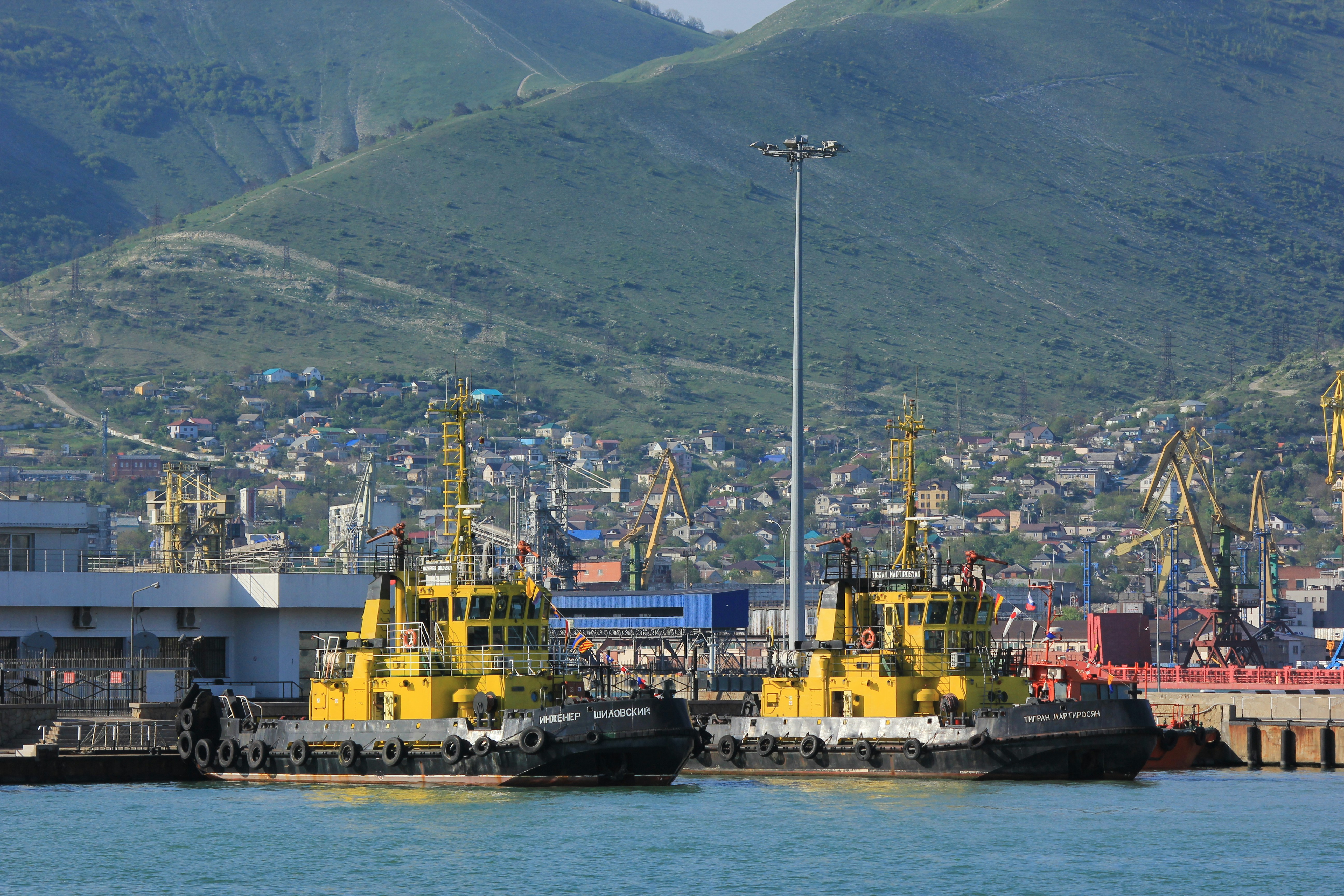 Two Yellow Tugboats, Hillside Harbor: A Working Waterfront Portrait