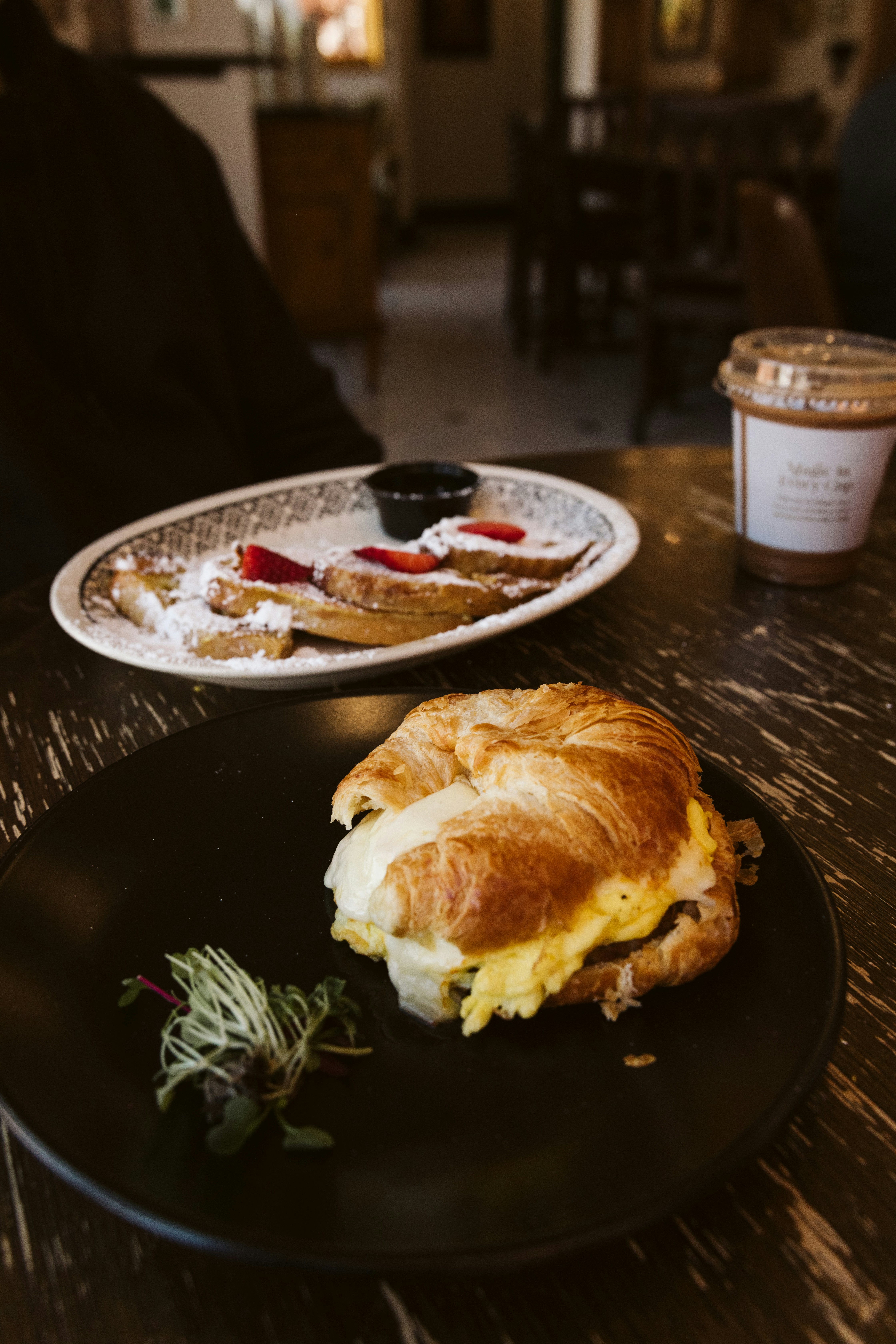 A breakfast sandwich and a cup of coffee on a table photo – Free Food ...