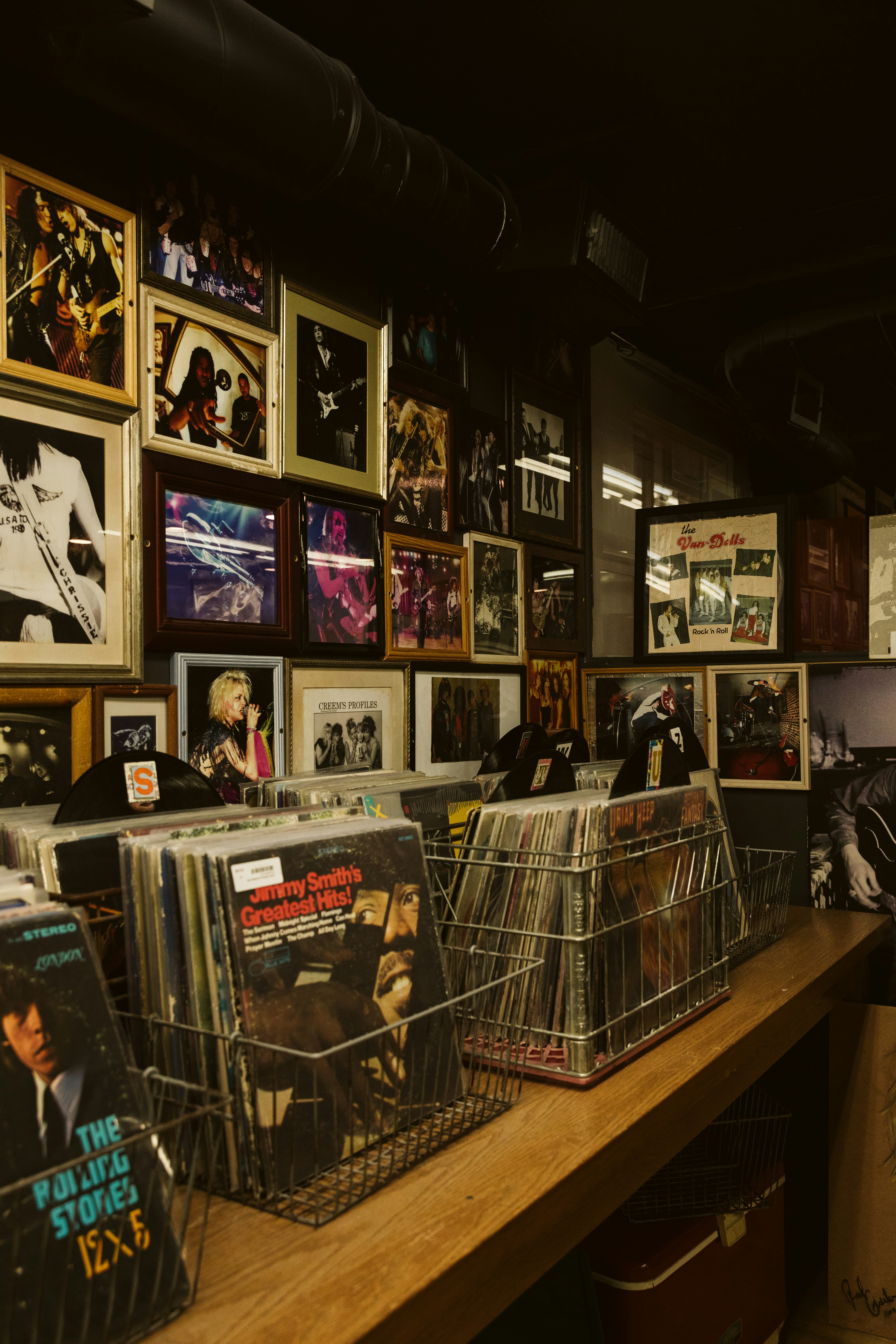 A wooden table topped with lots of records photo – Free Record Image on ...