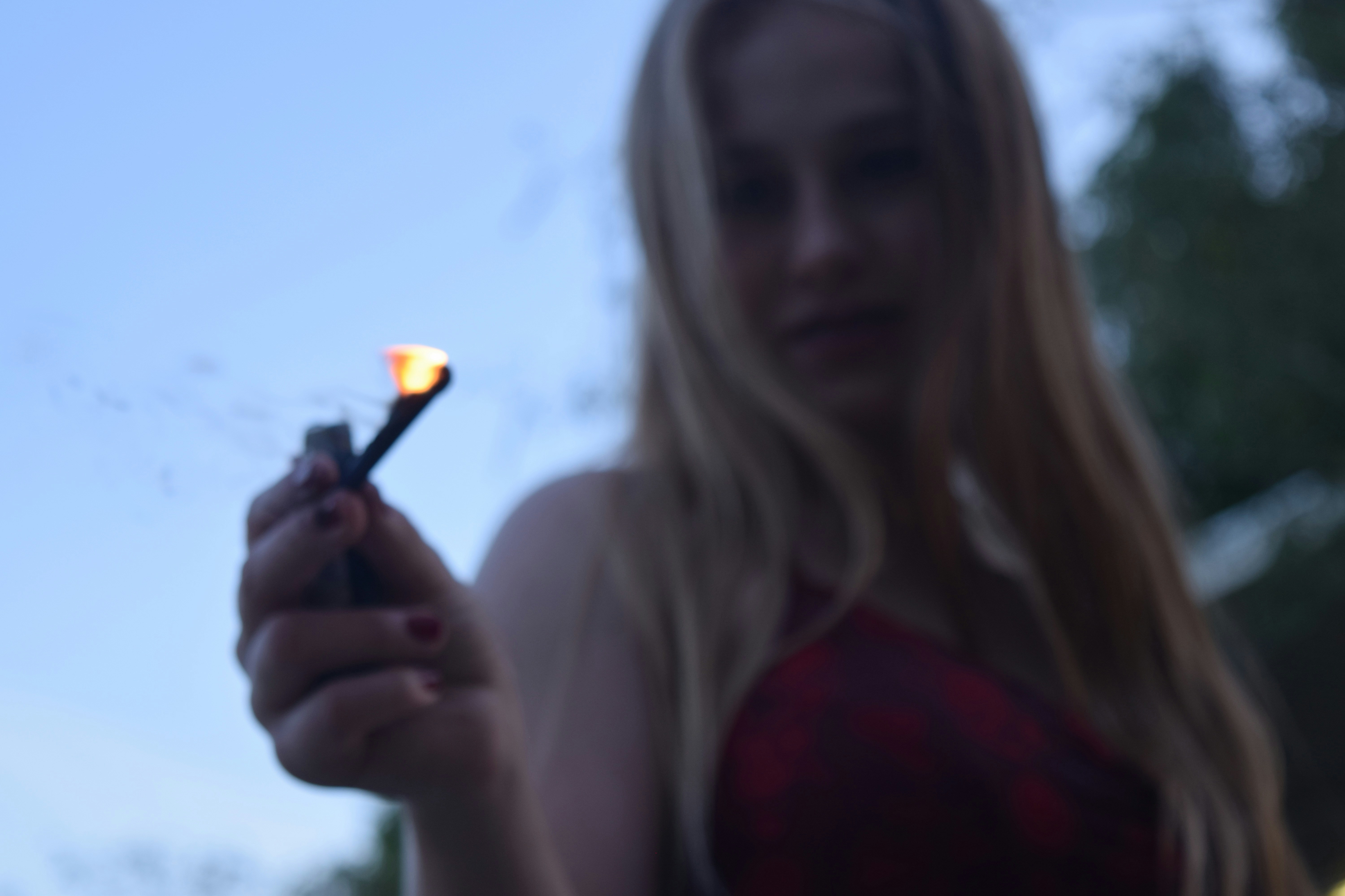 Twilight Ember: A Softly Focused Moment with a Lighter
