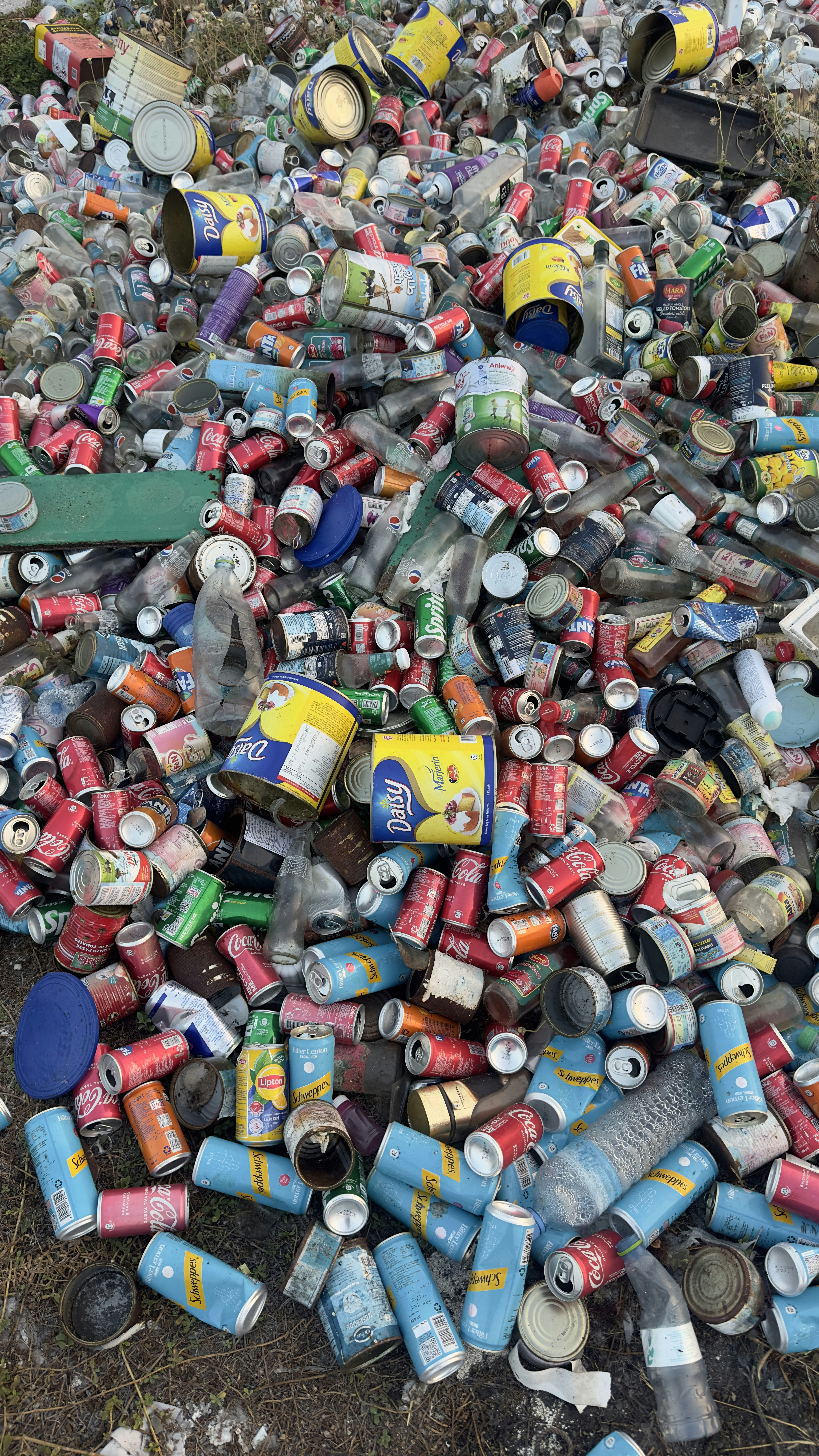A pile of cans and cans of various sizes and colors photo – Free ...
