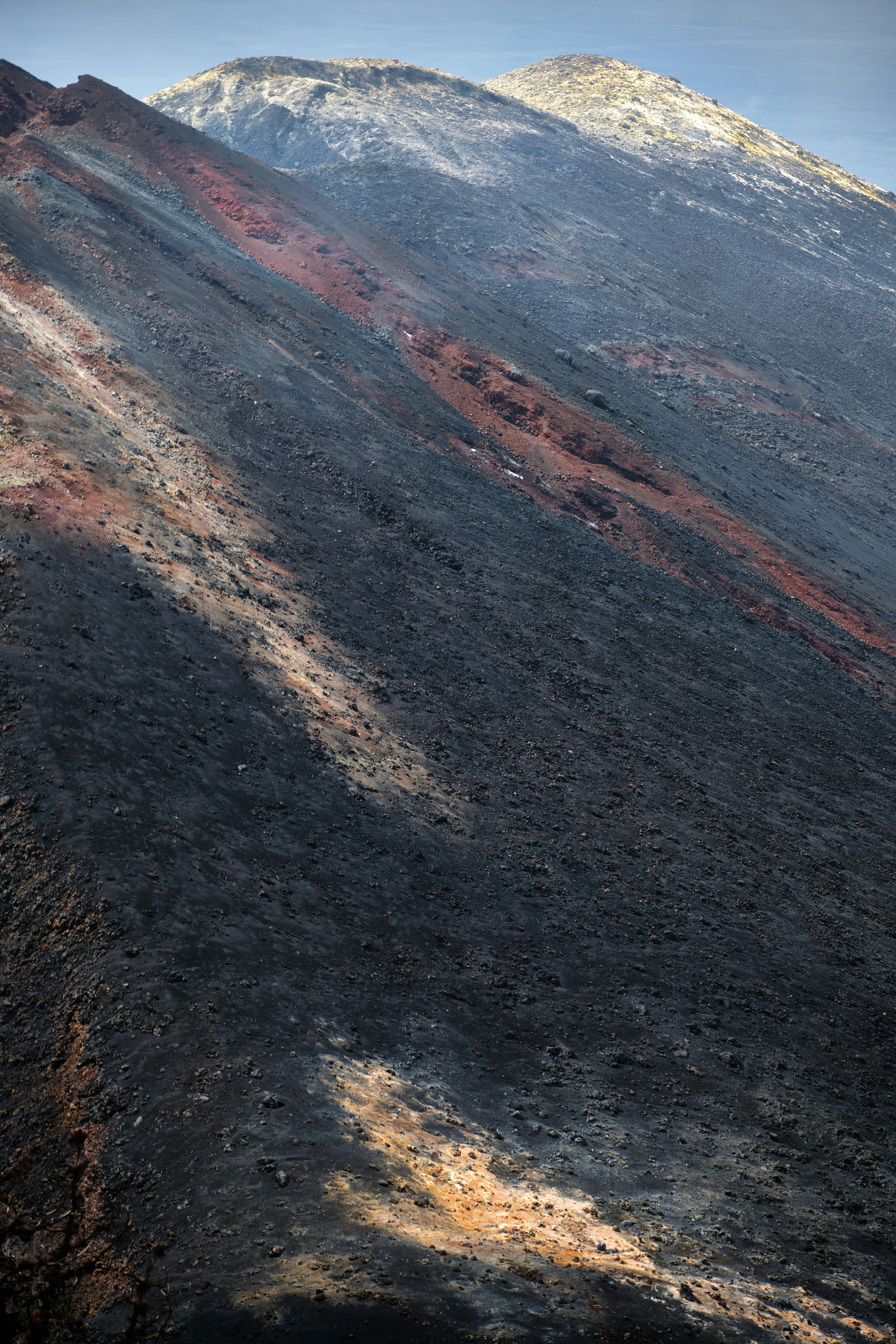 A large mountain with a very steep slope on top of it photo – Free ...