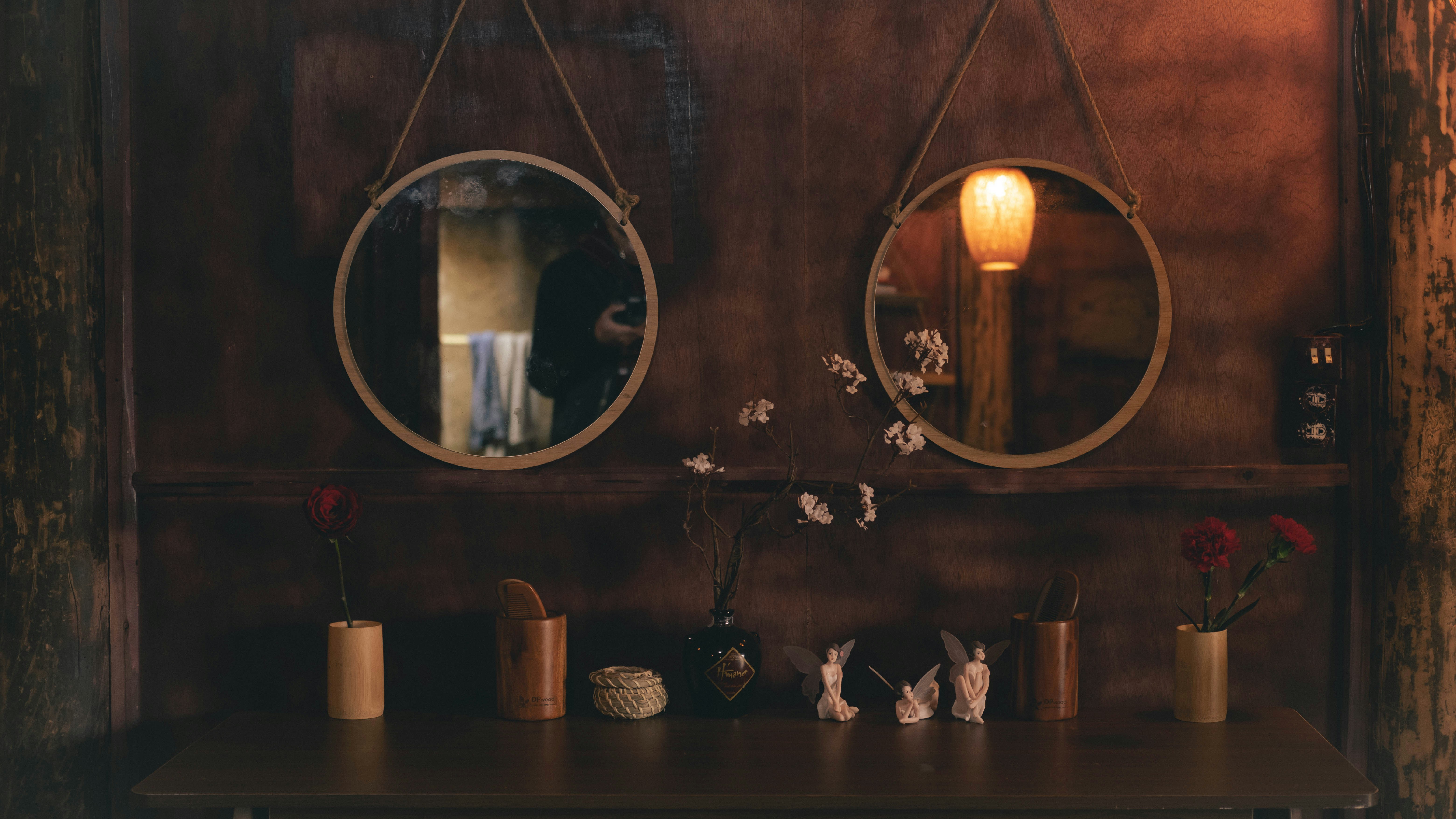 A couple of mirrors hanging on the side of a wall photo – Free Human ...