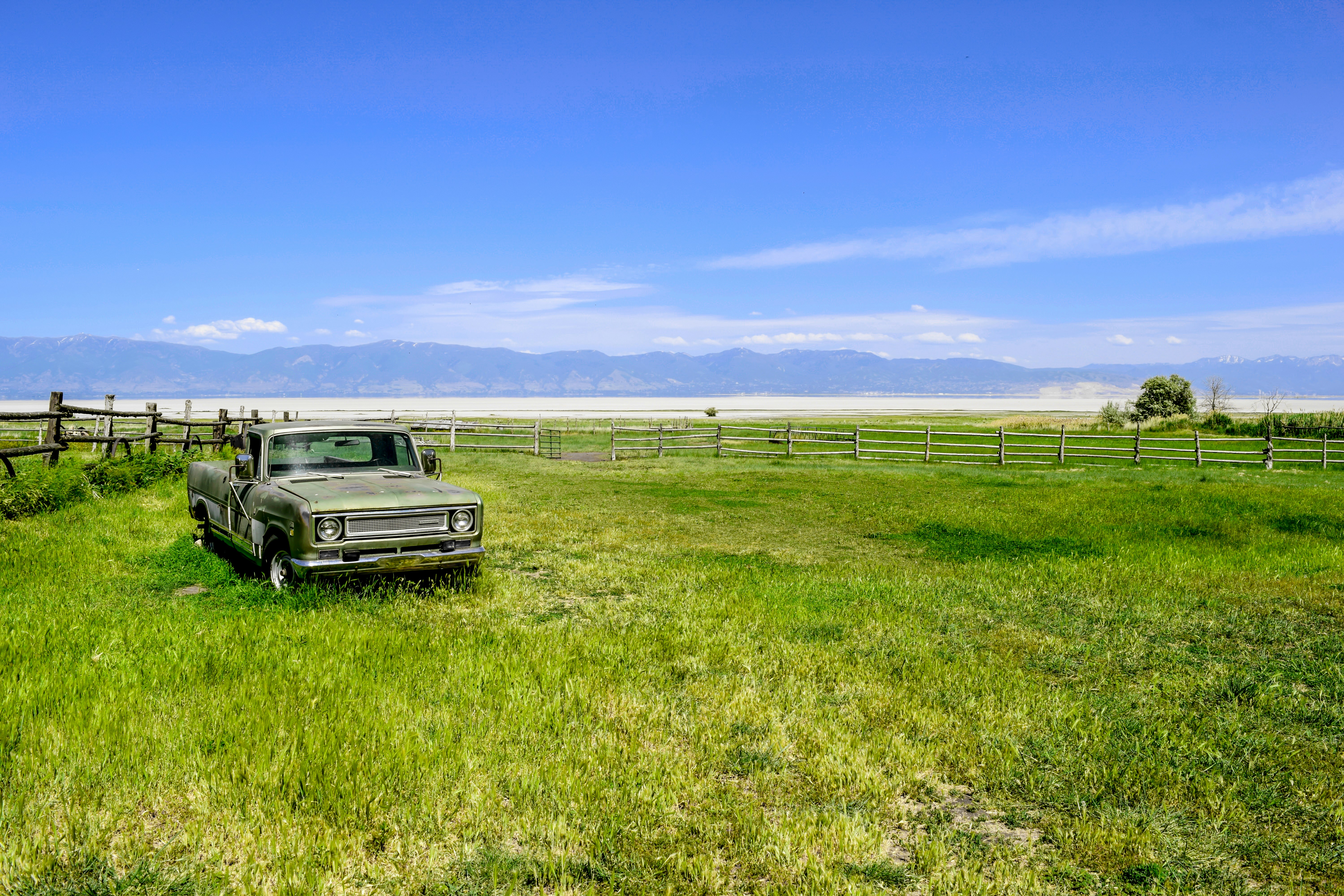 Weathered Pickup at the Field's Edge Under a Clear Blue Sky