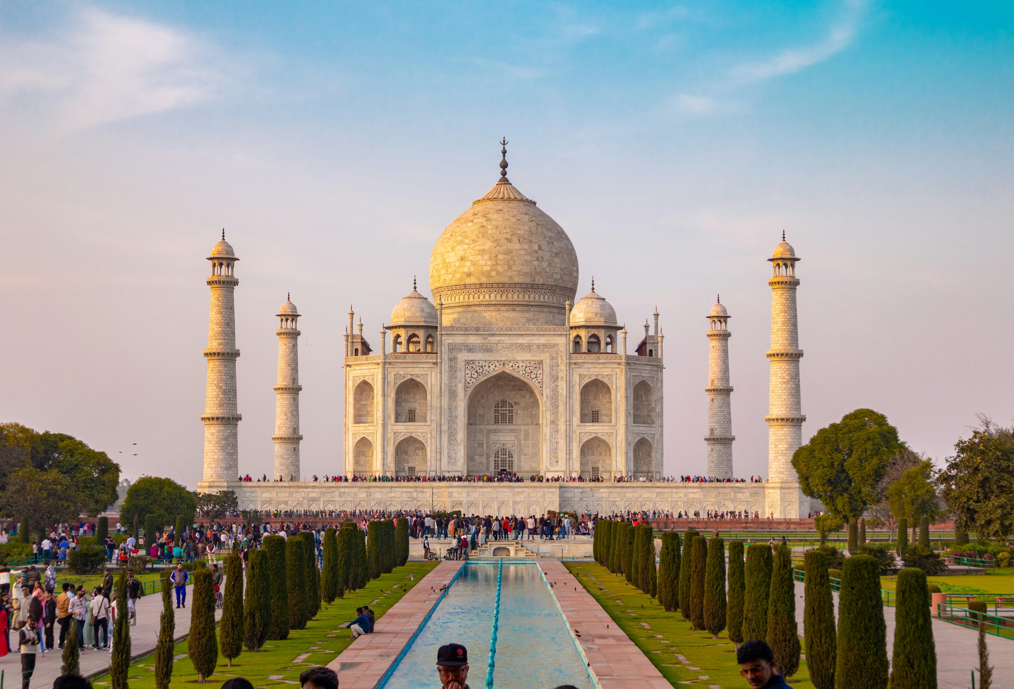 Taj Mahal, Agra, India | a group of people standing in front of a building
