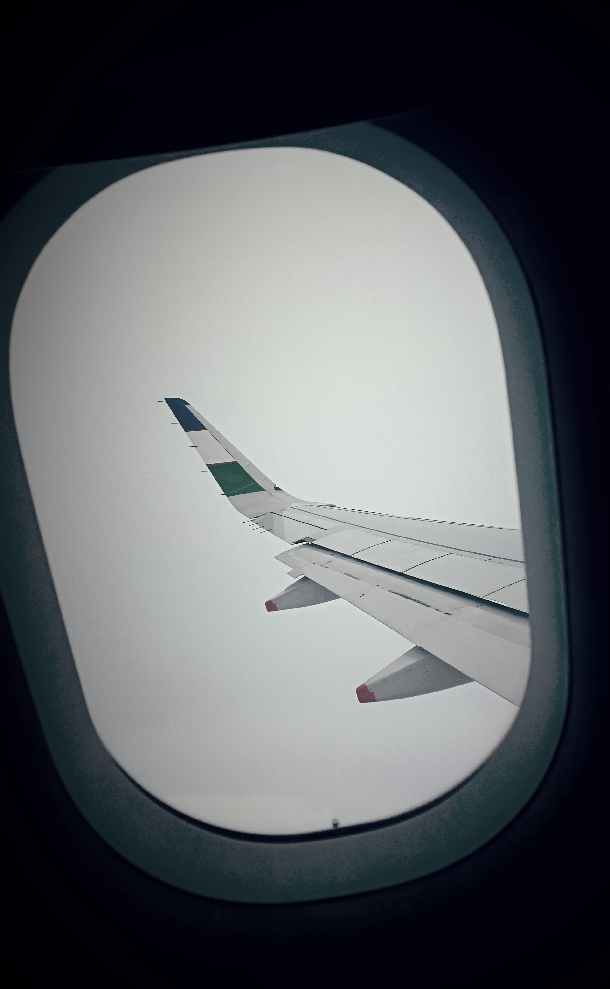 A view of the wing of an airplane through a window photo – Free Plane ...