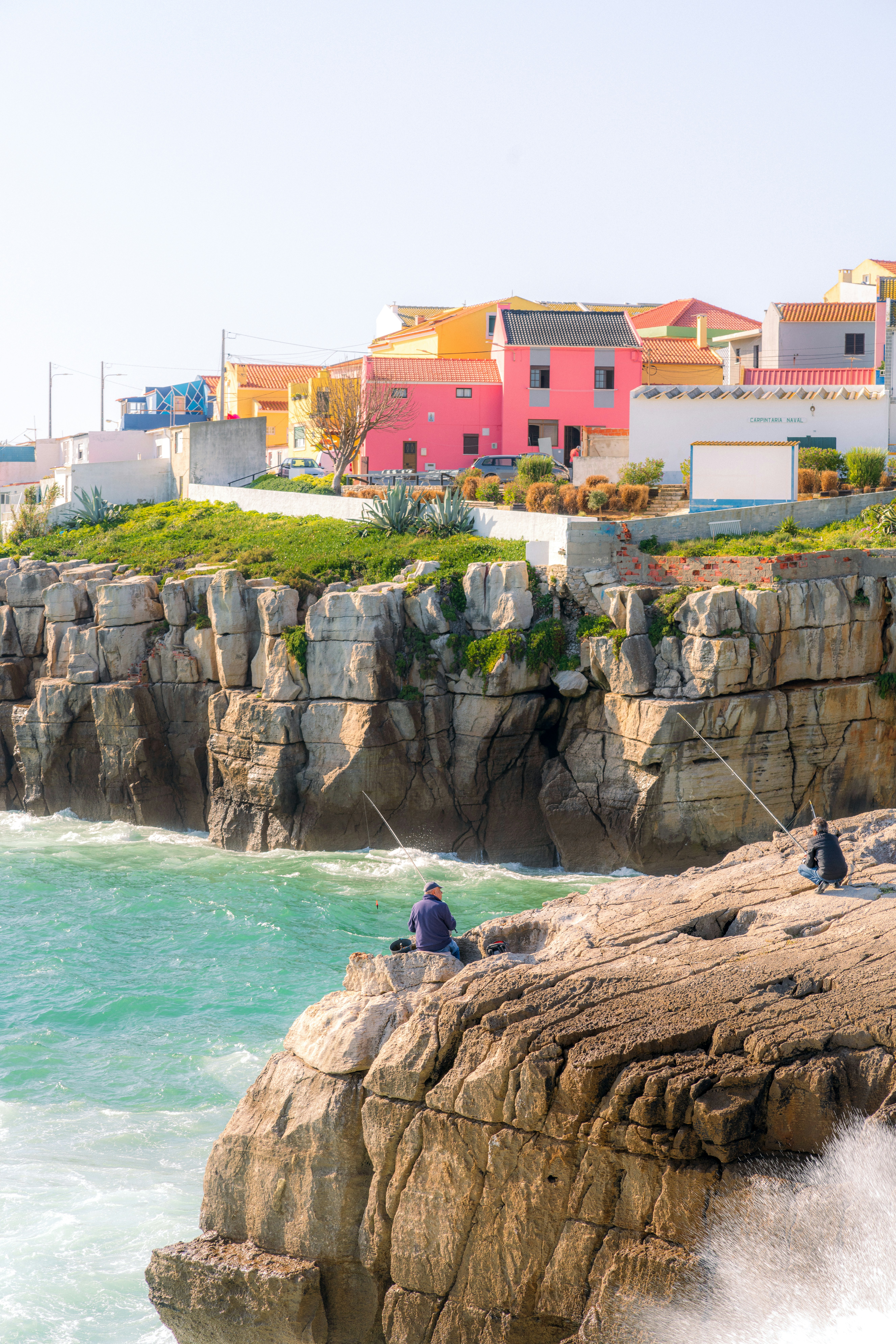 Pastel Cliffside Village Over Turquoise Seas