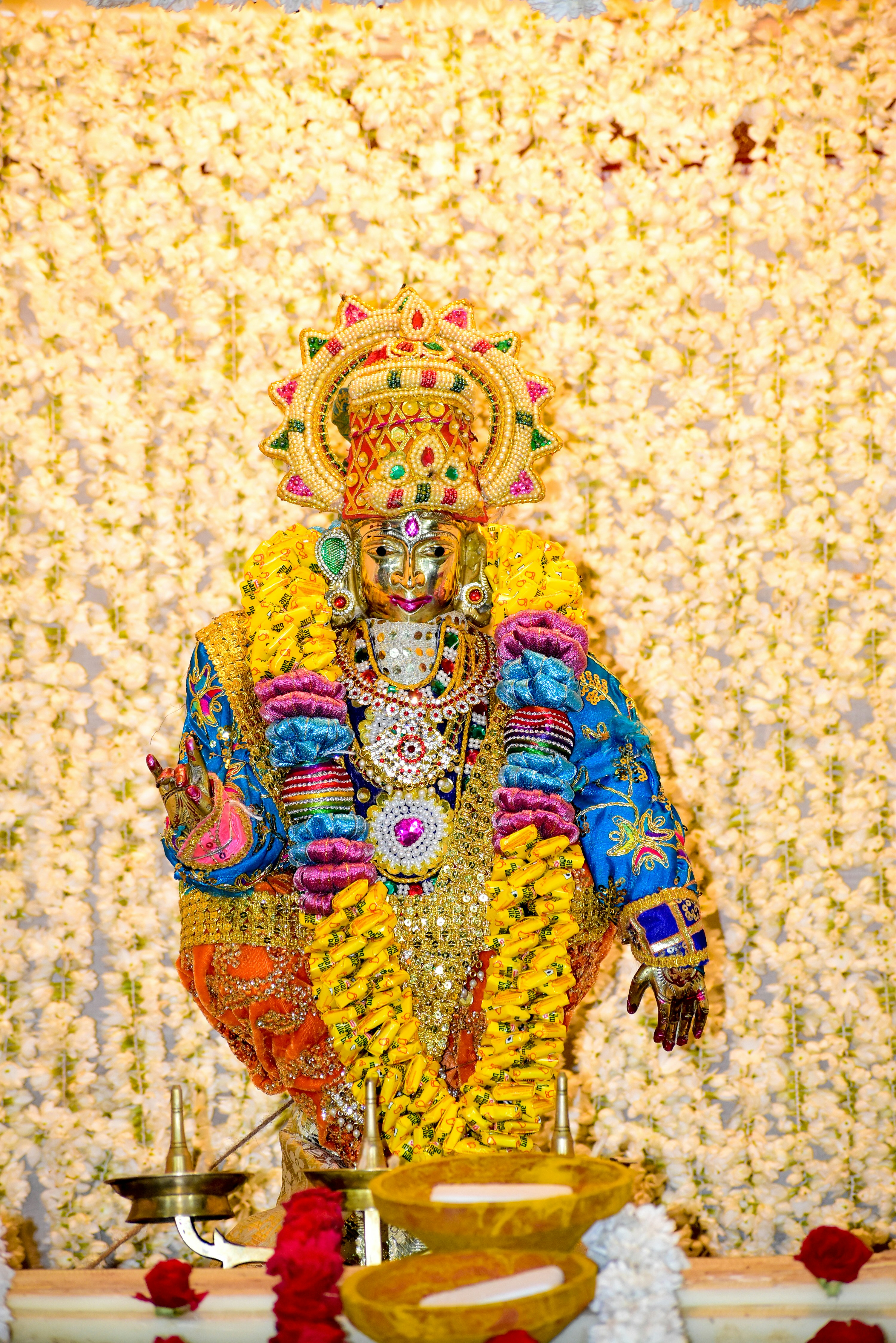 A statue of a hindu god in front of a backdrop photo – Free Decorative ...