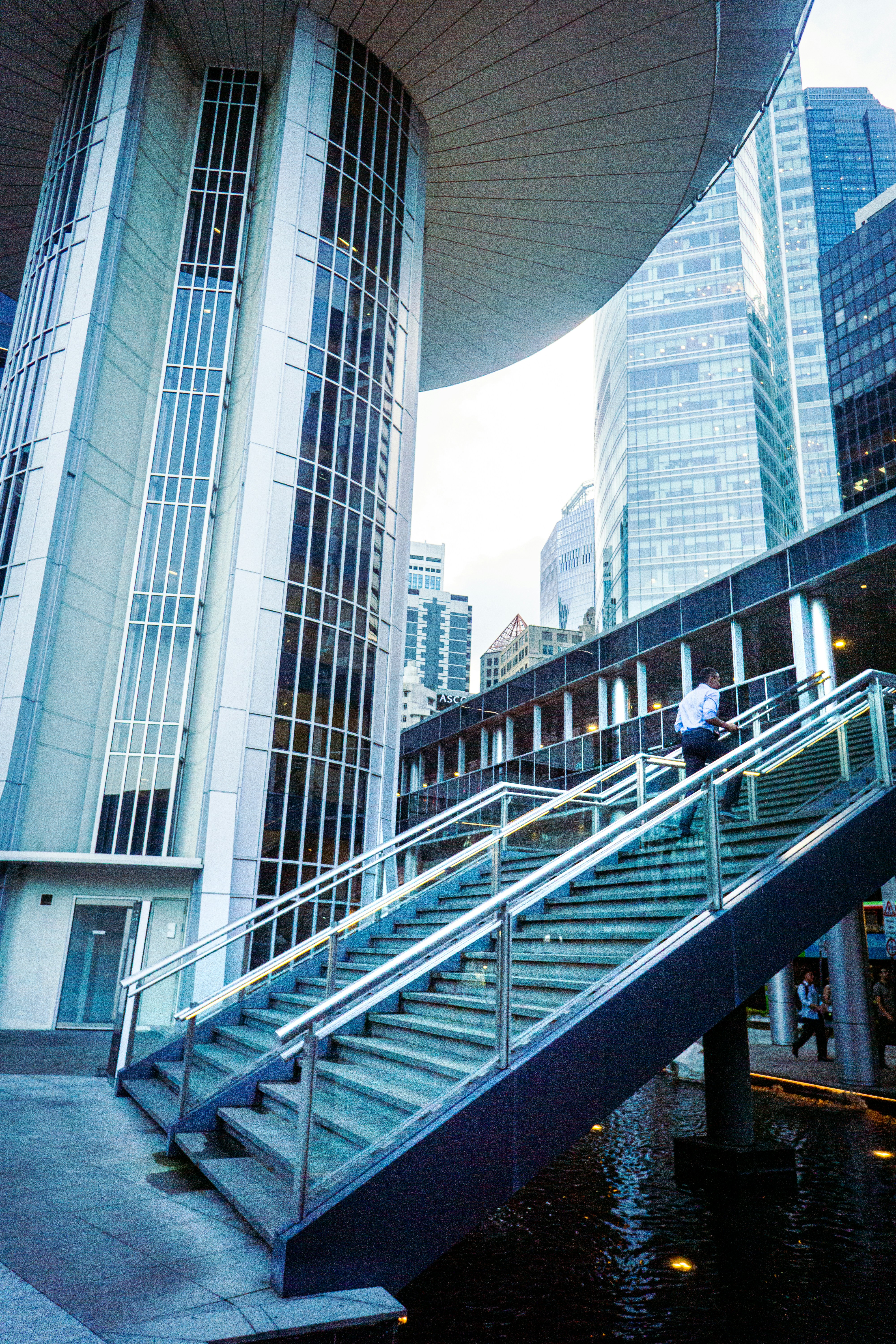 A man riding a skateboard down a metal handrail photo – Free Singapore ...