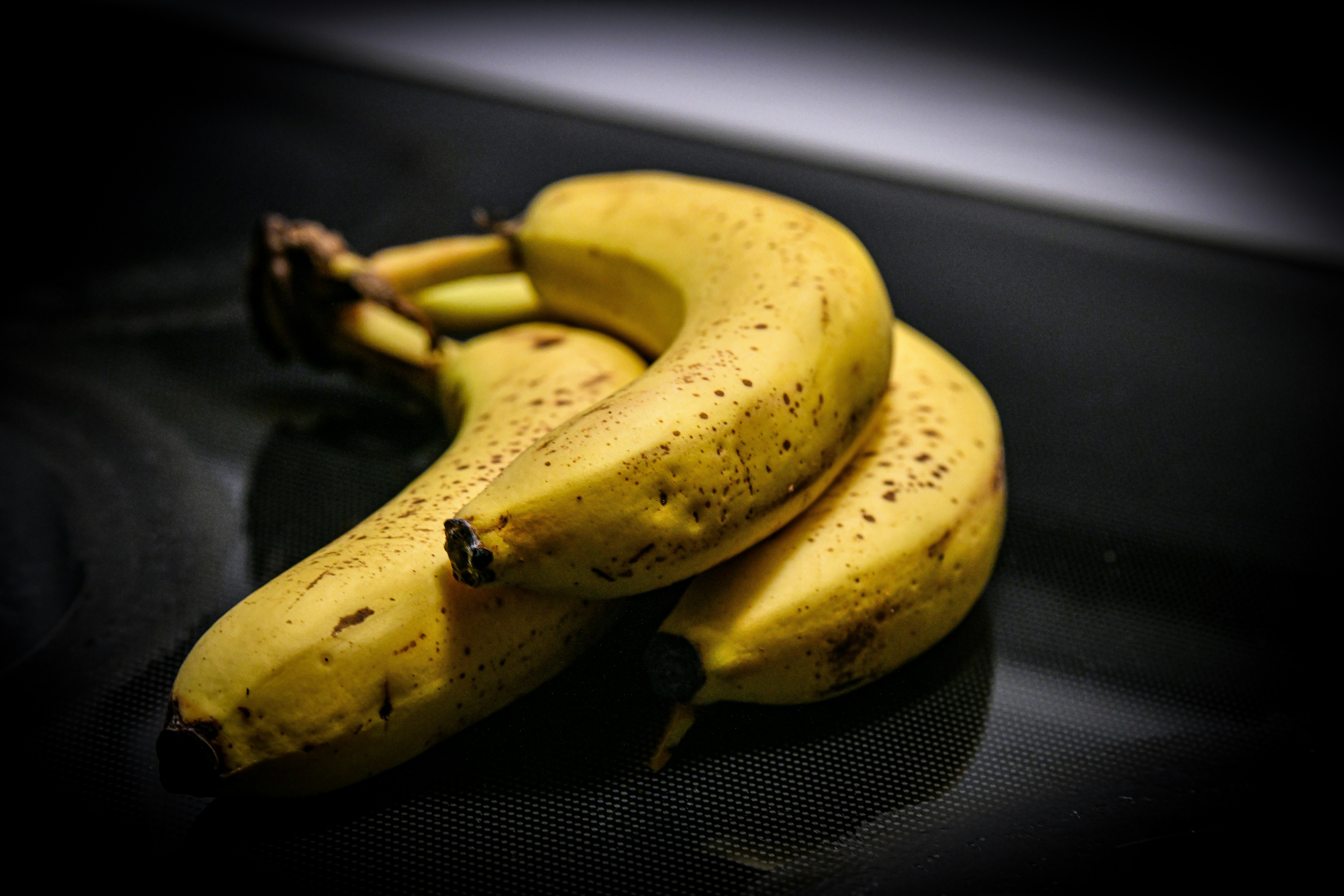 A bunch of ripe bananas sitting on top of a table photo – Free Chicago ...