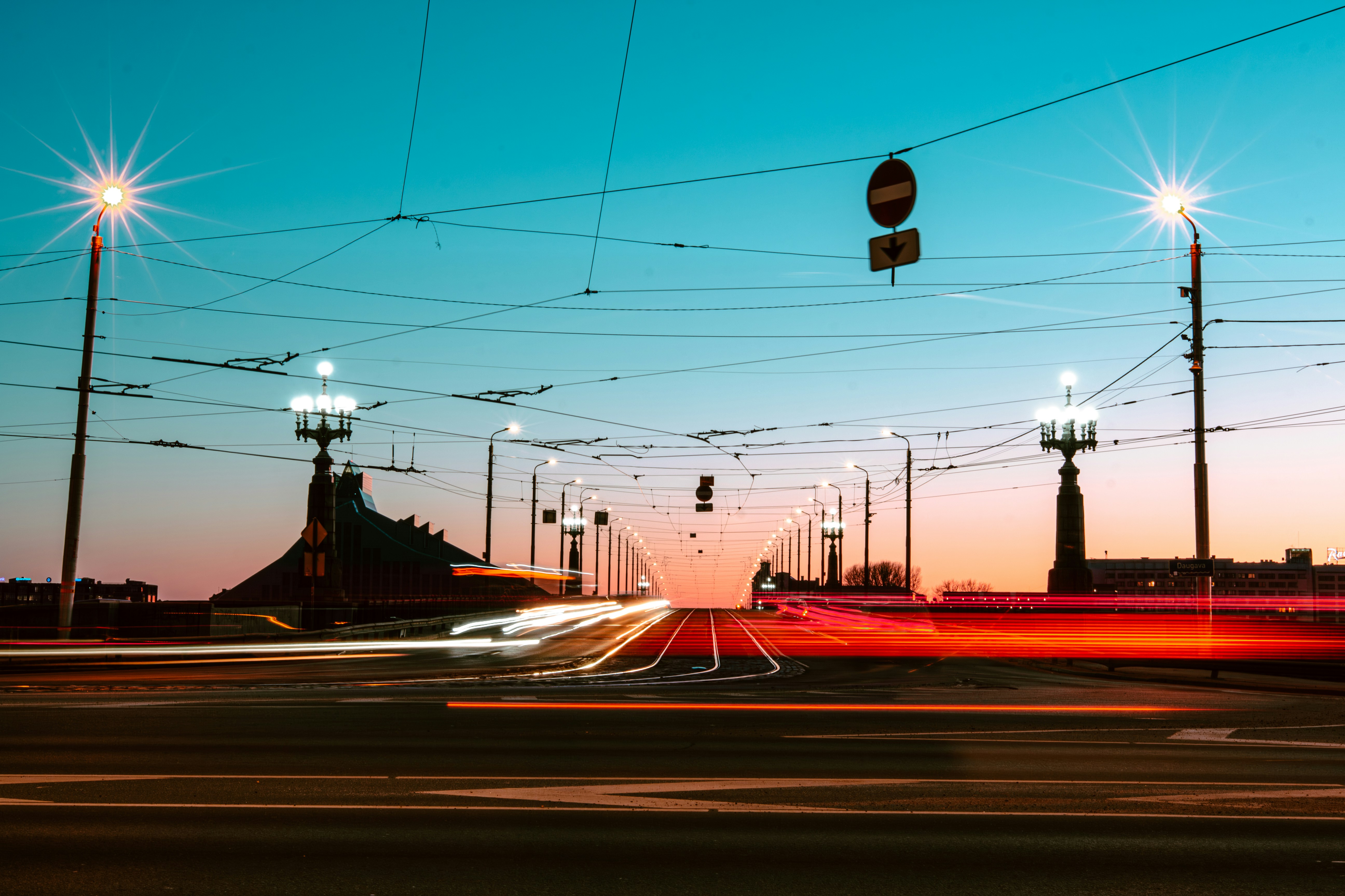 A city street with traffic lights and street signs photo – Free Road ...