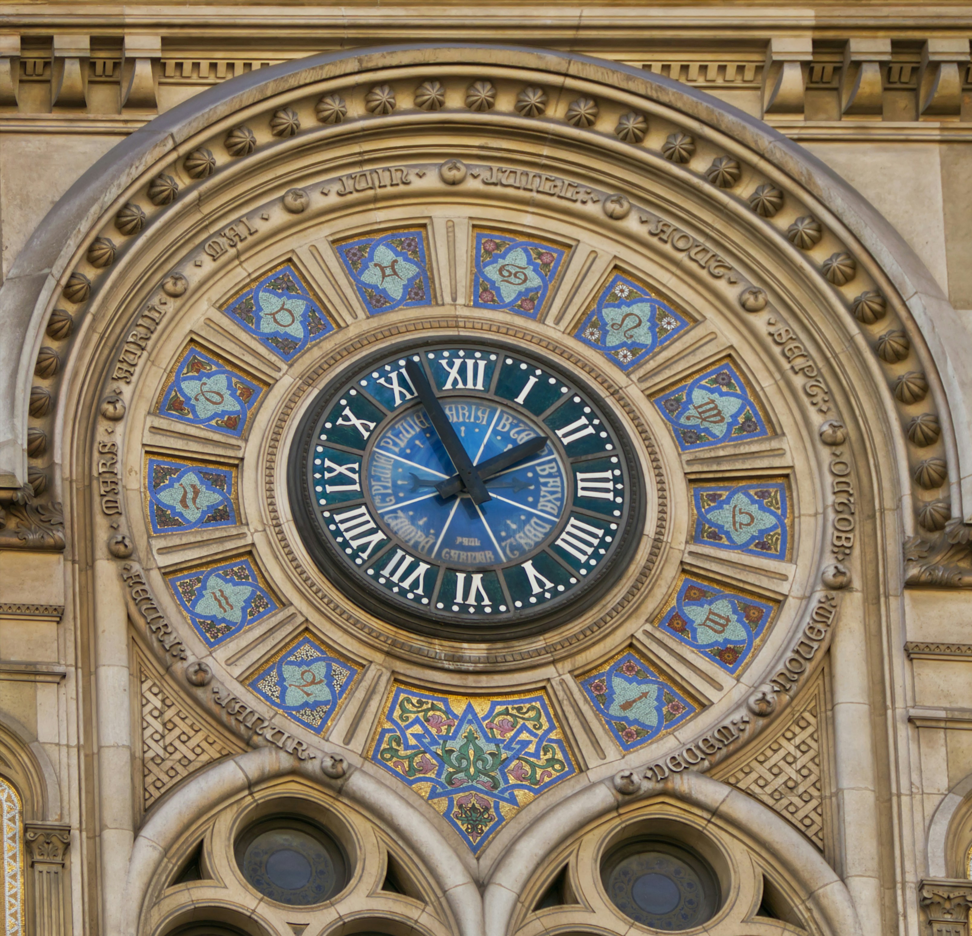 The Ringed Clock: Roman Timekeeper Set in Ornate Facade Mosaic