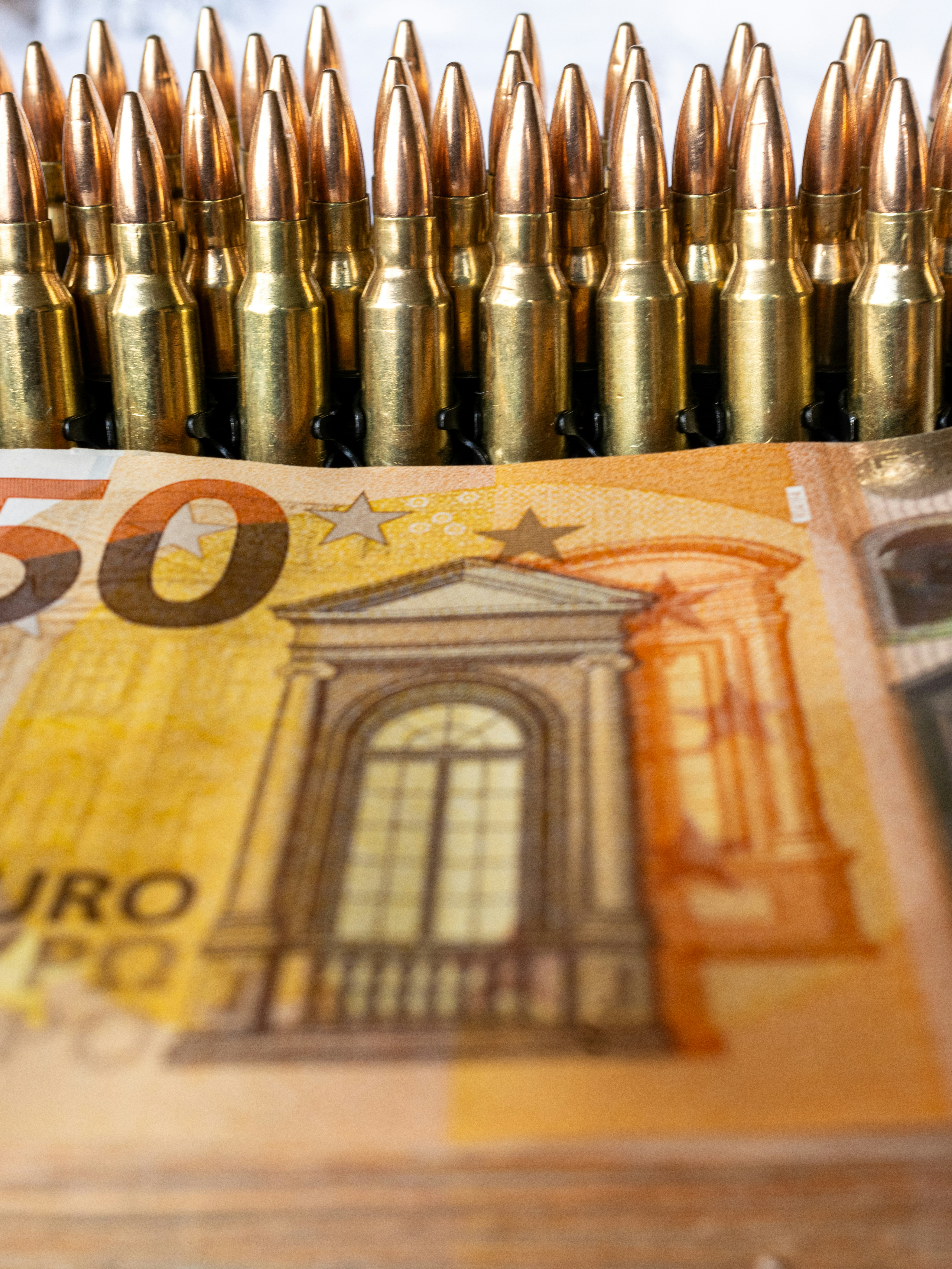 Bullion Bloom: A Row of Bullets Above a 50-Euro Note
