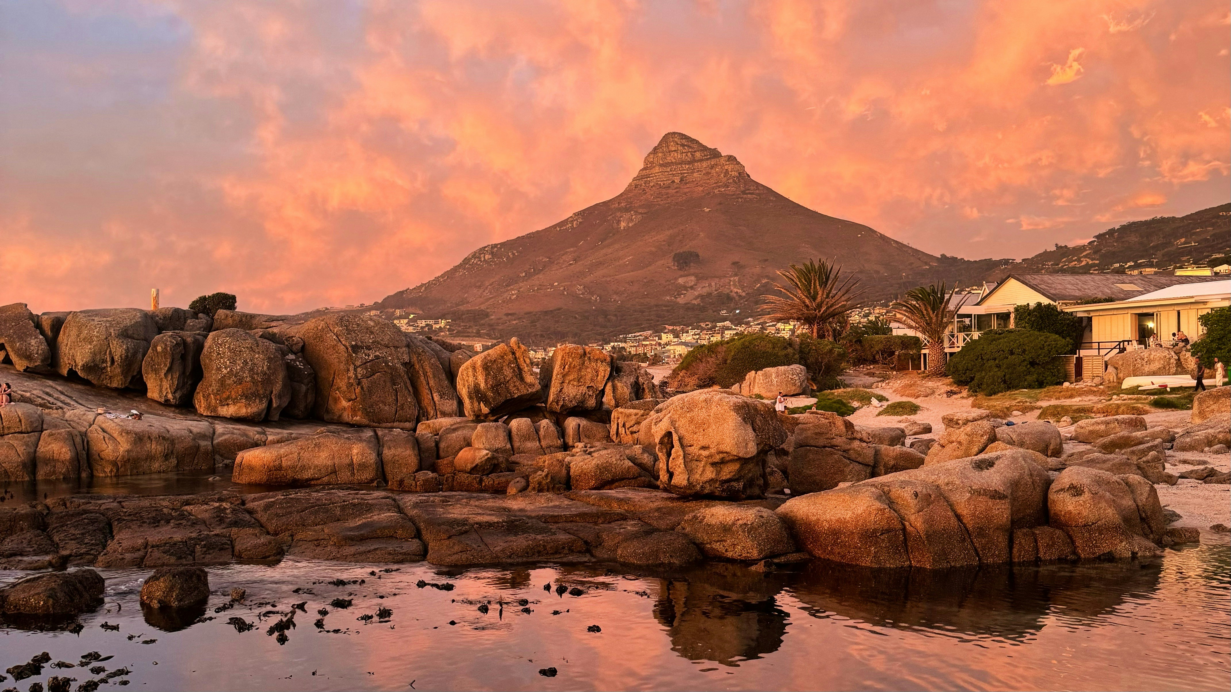 Crimson Peak Over a Rugged Seaside at Sunset