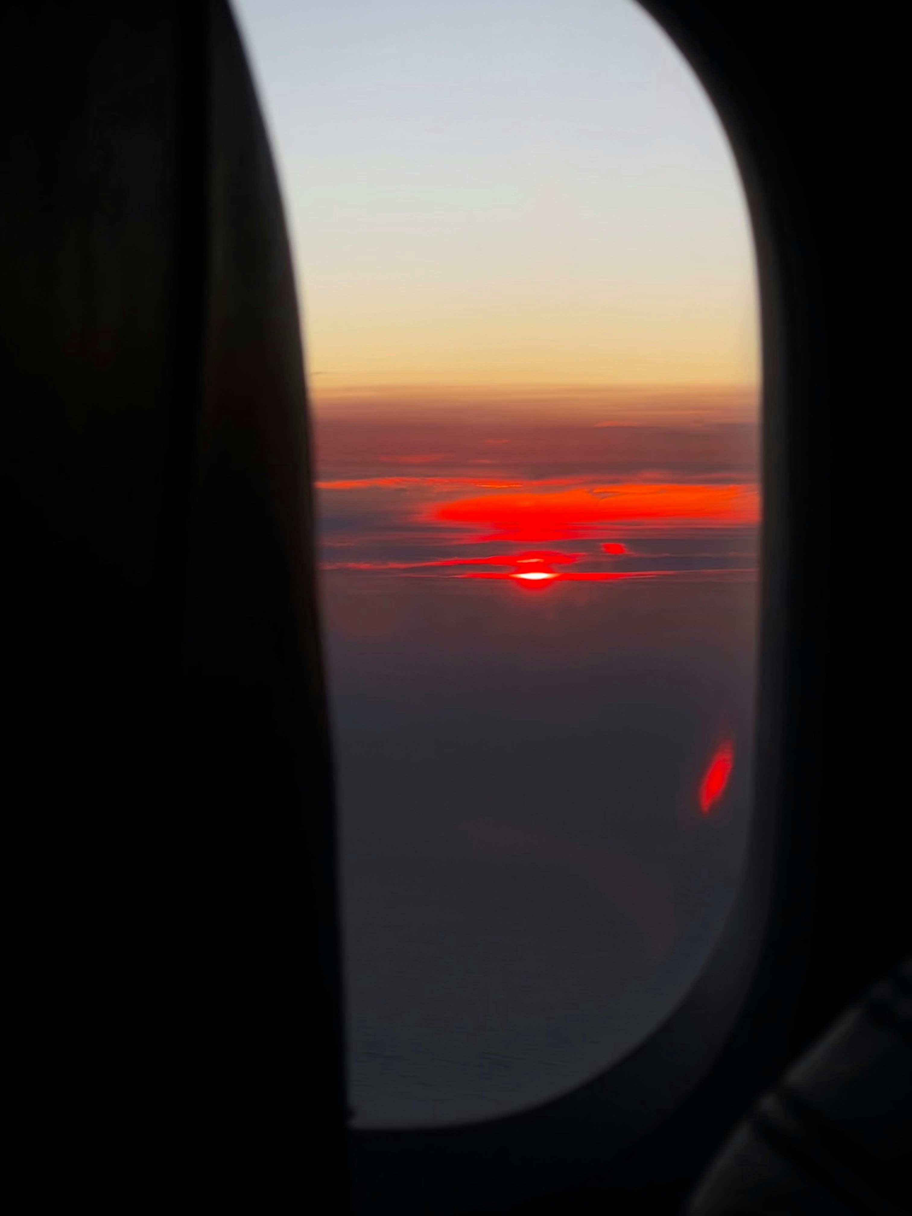 Crimson Horizon Through the Cabin Window