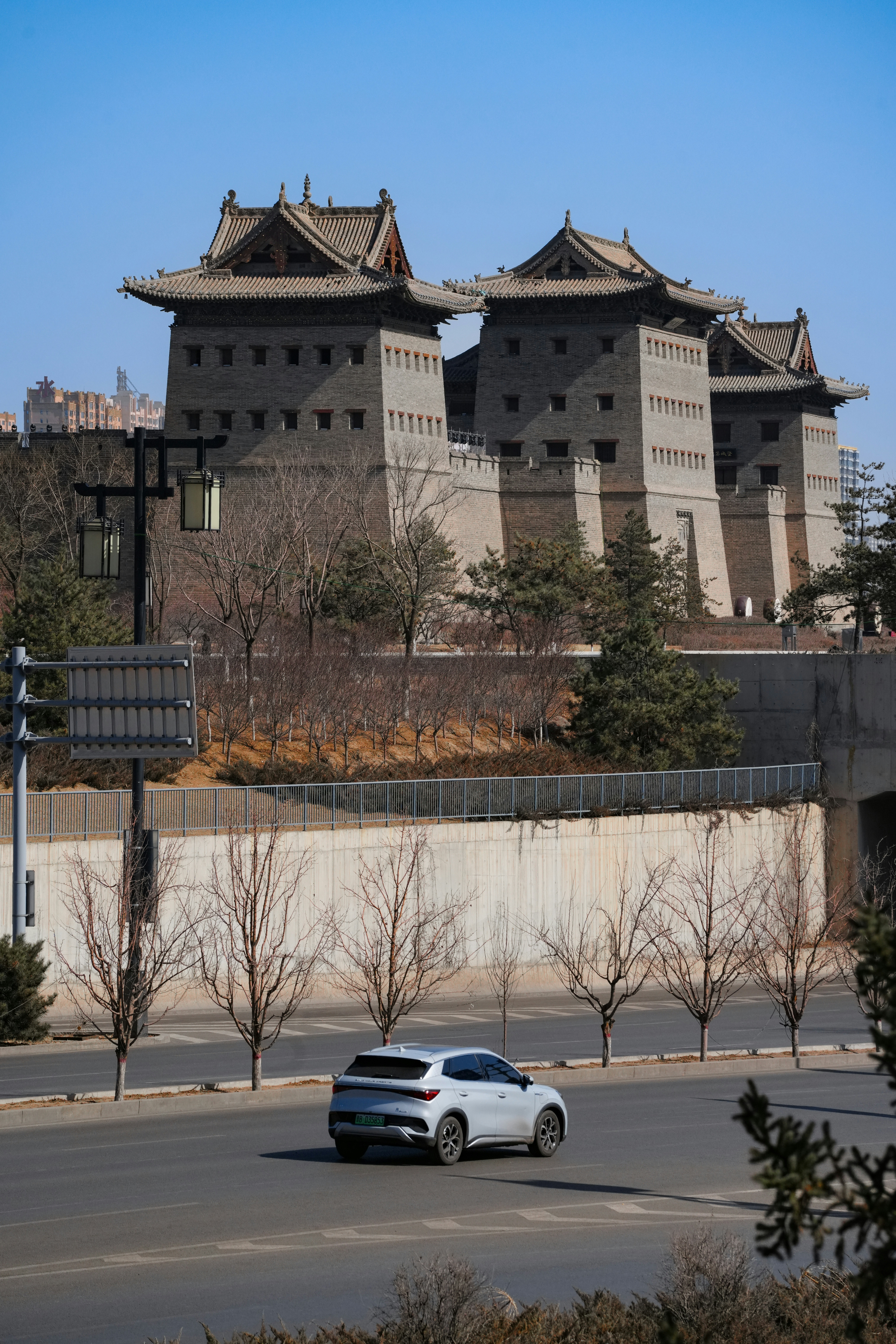 Ancient Gatehouse Overlooked by a Pared-Back Street