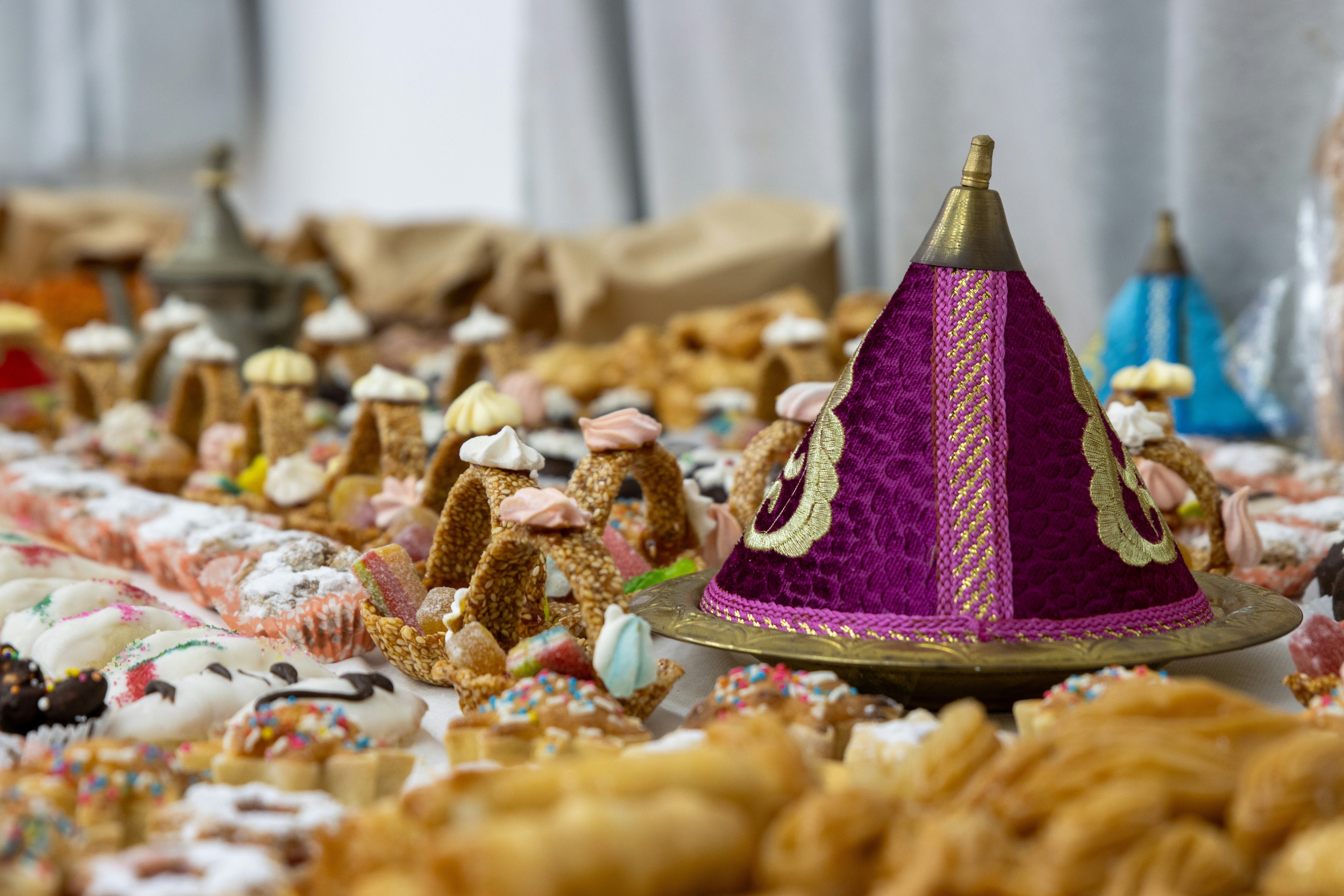 Purple Cone Crown Amid a Sea of Pastries