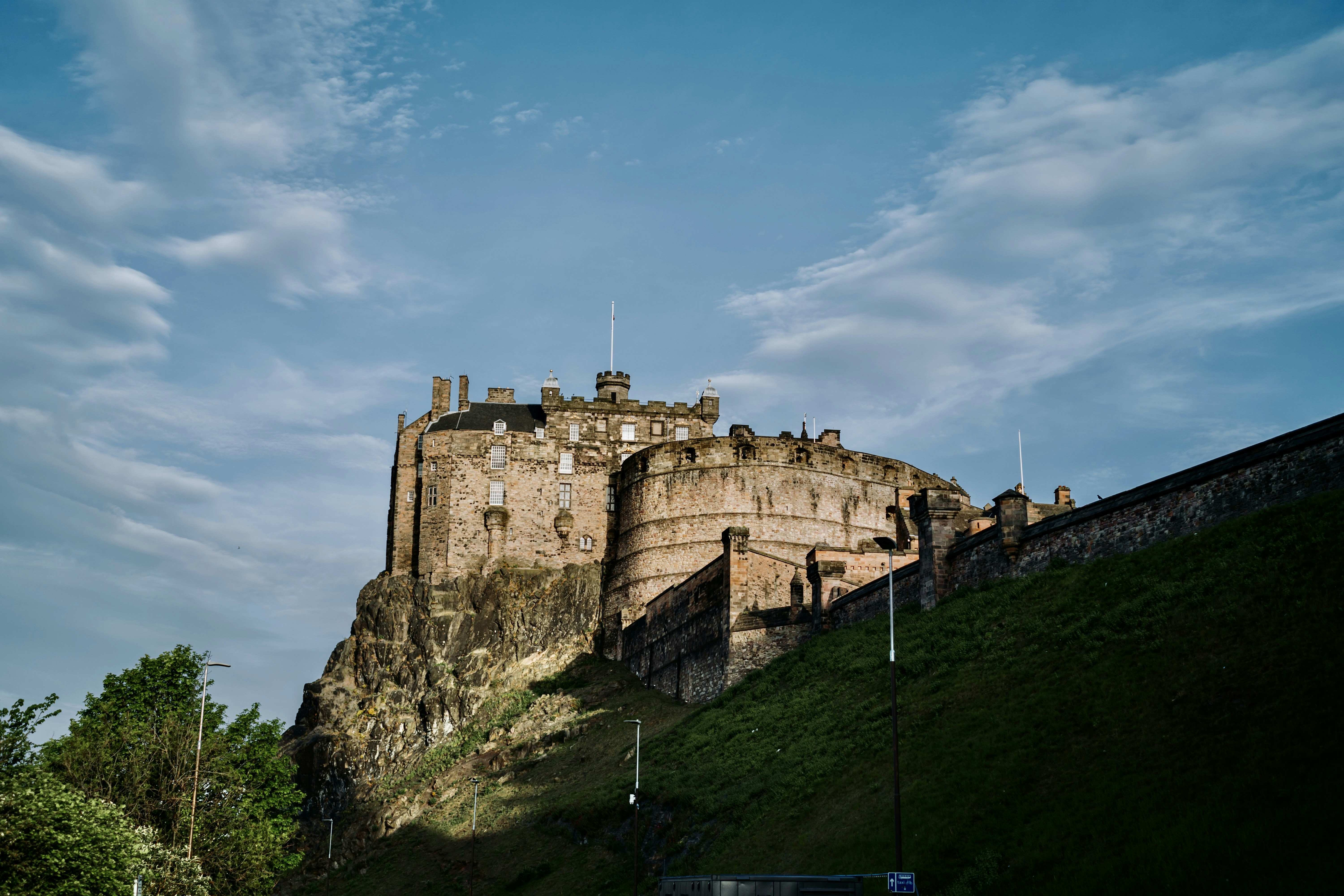 A very tall castle sitting on top of a hill photo – Free Castle Image ...