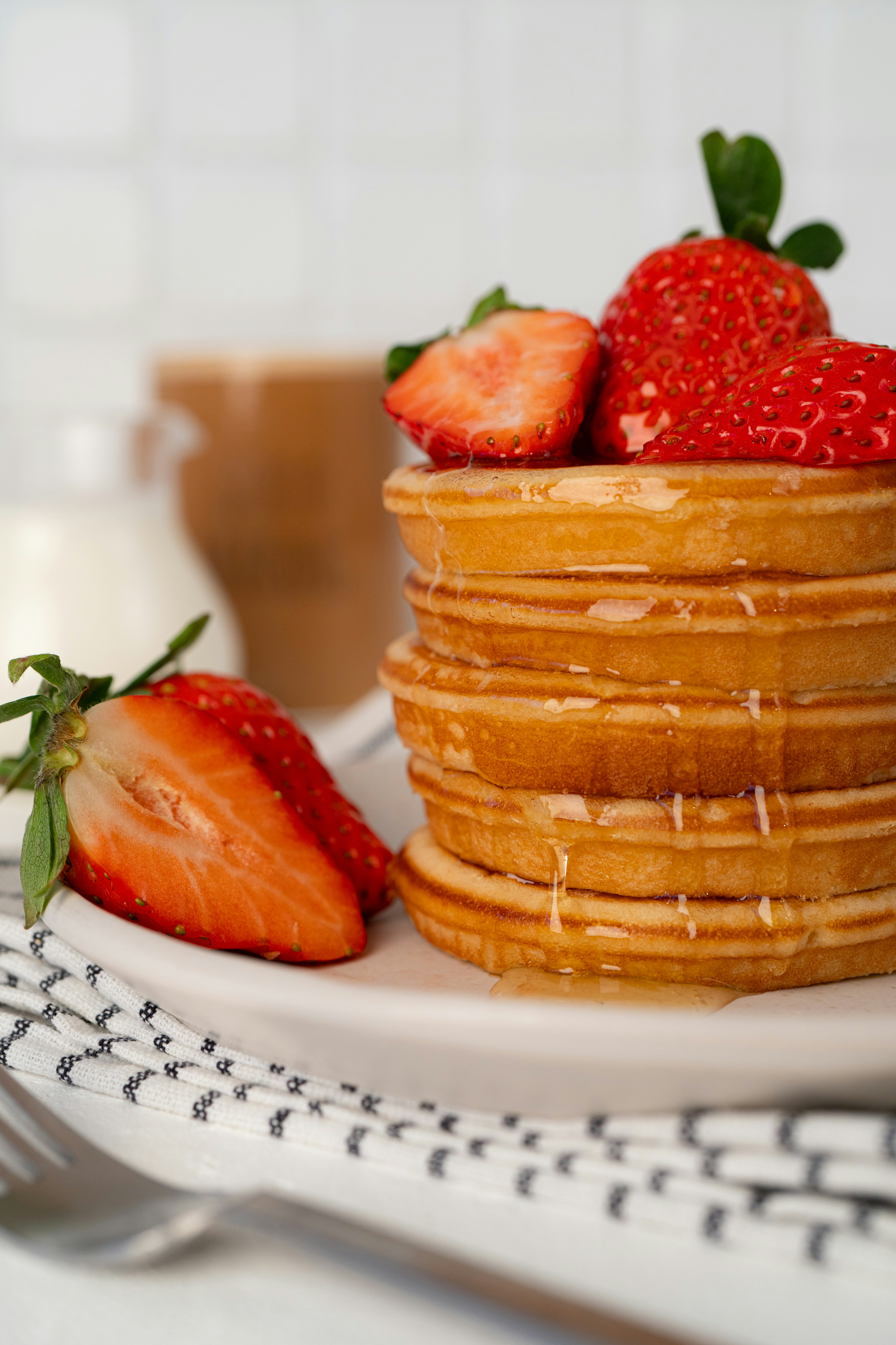 A stack of pancakes with strawberries on a plate photo – Free Berry ...
