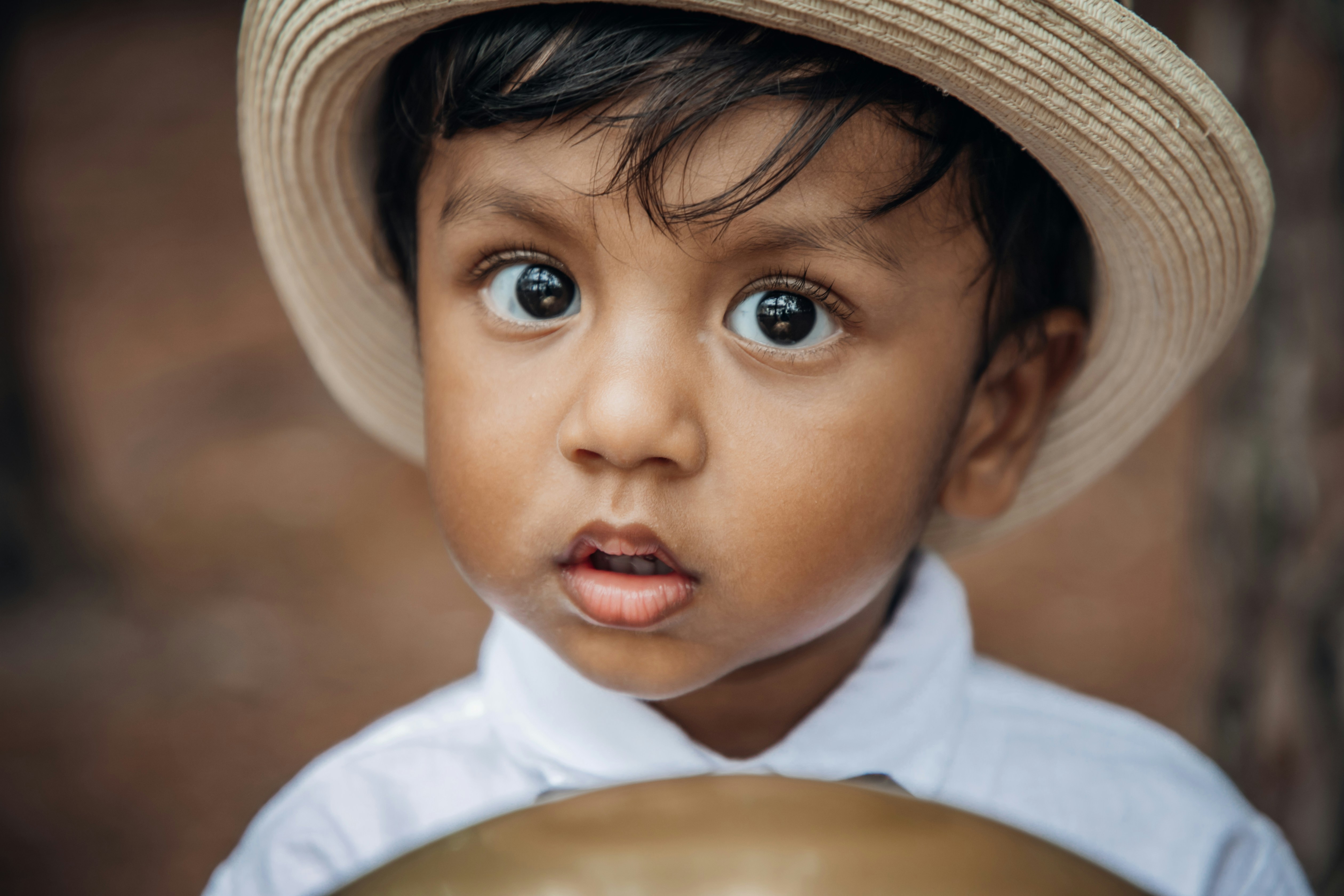 A little boy with a hat on his head photo – Free Indian boy Image on ...
