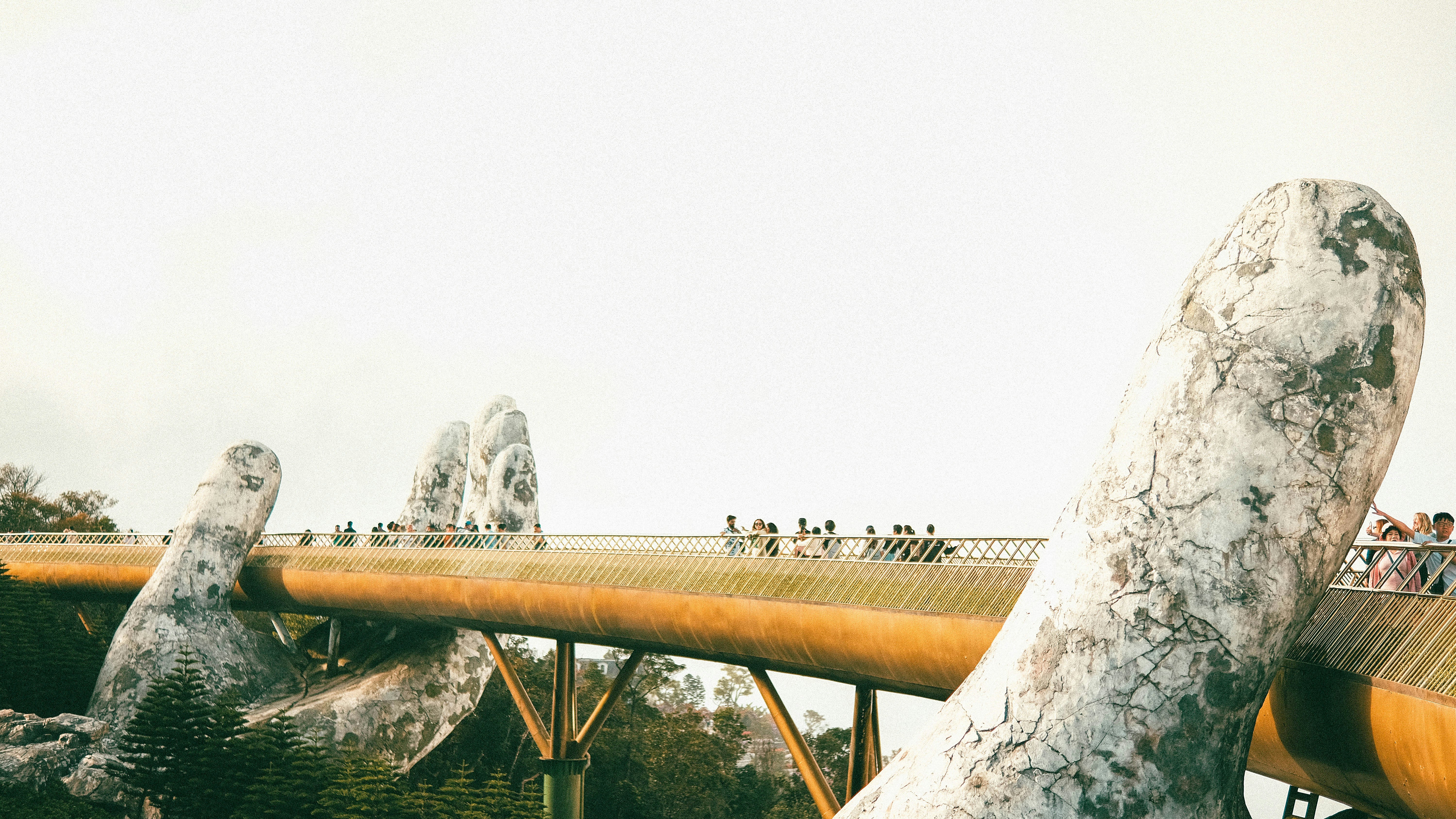 A wooden bridge with people walking across it photo – Free Golden hands ...