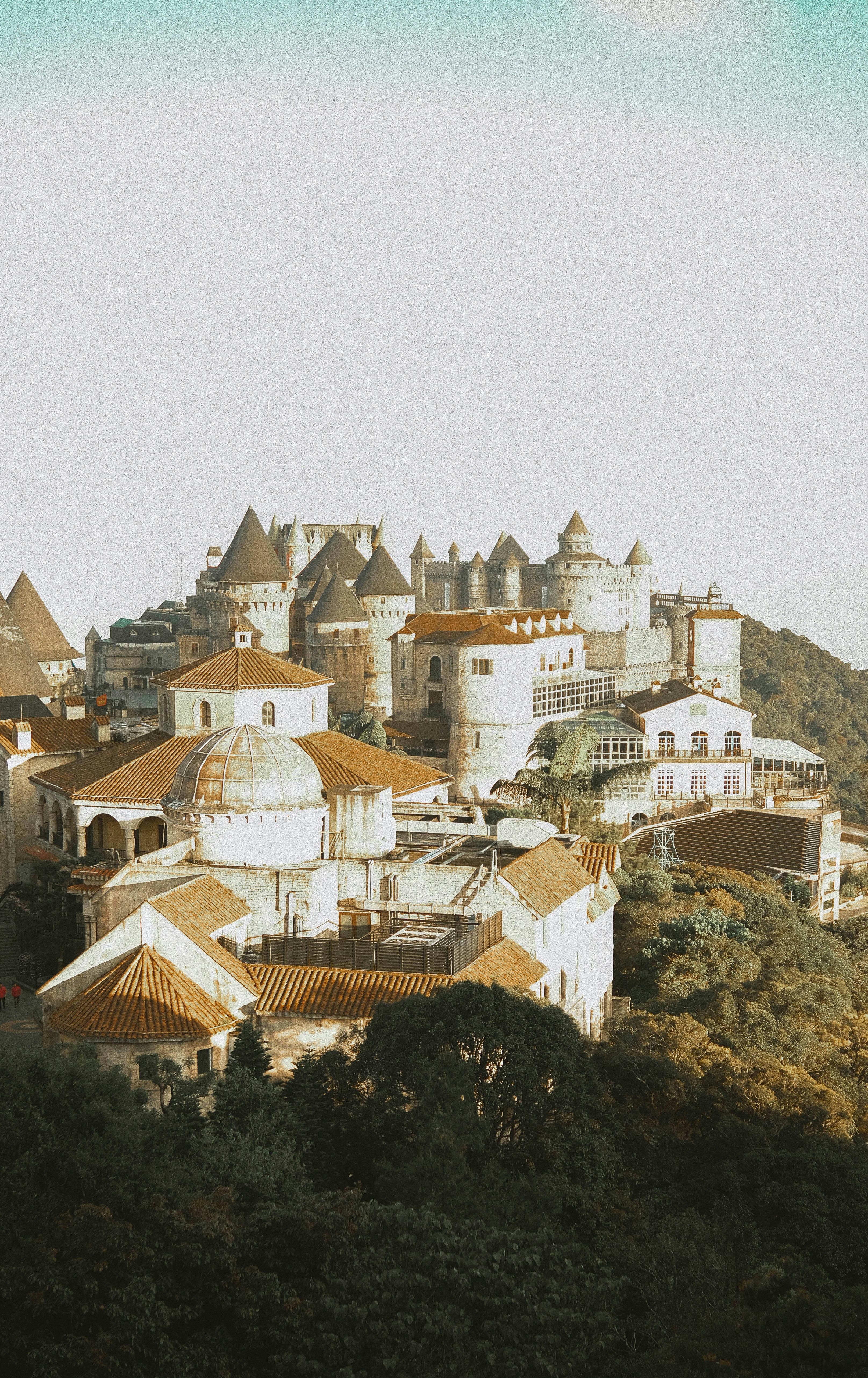 Hilltop Castle Array: Cone-Topped Turrets Rising Above the Forest