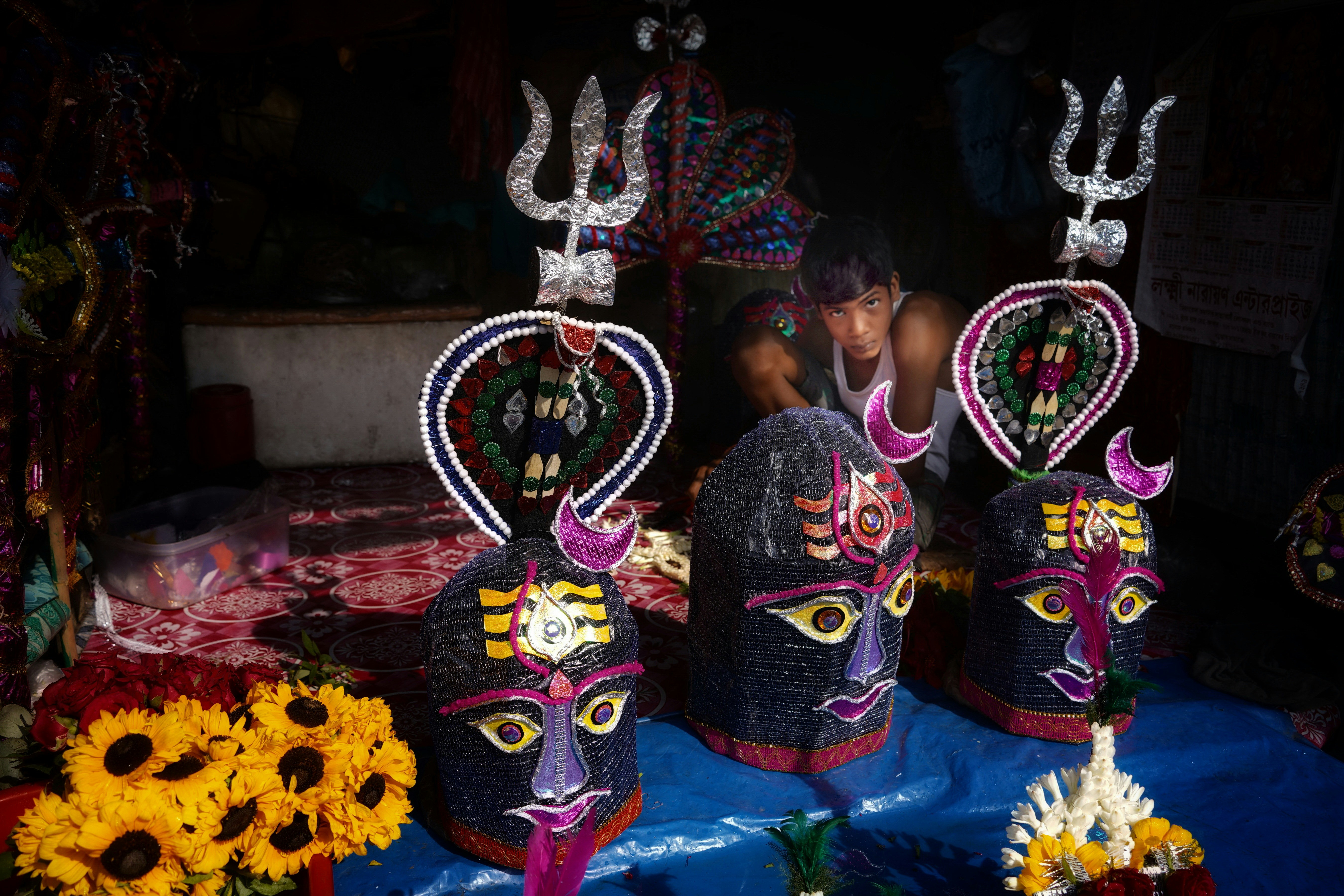A group of masks sitting on top of a blue table photo – Free Background ...