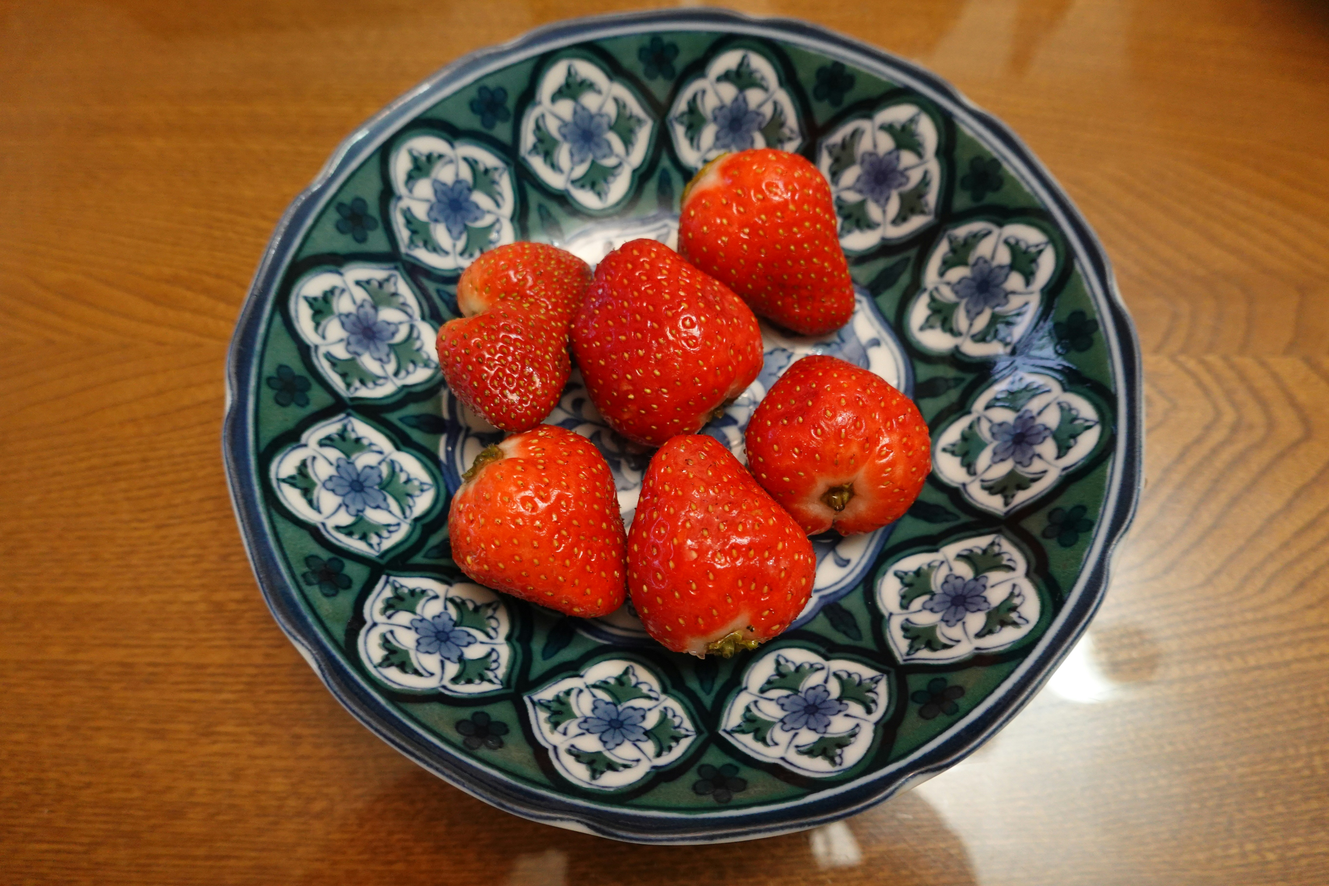 Centerpiece of Ruby Berries in a Blue-Green Ceramic Bowl