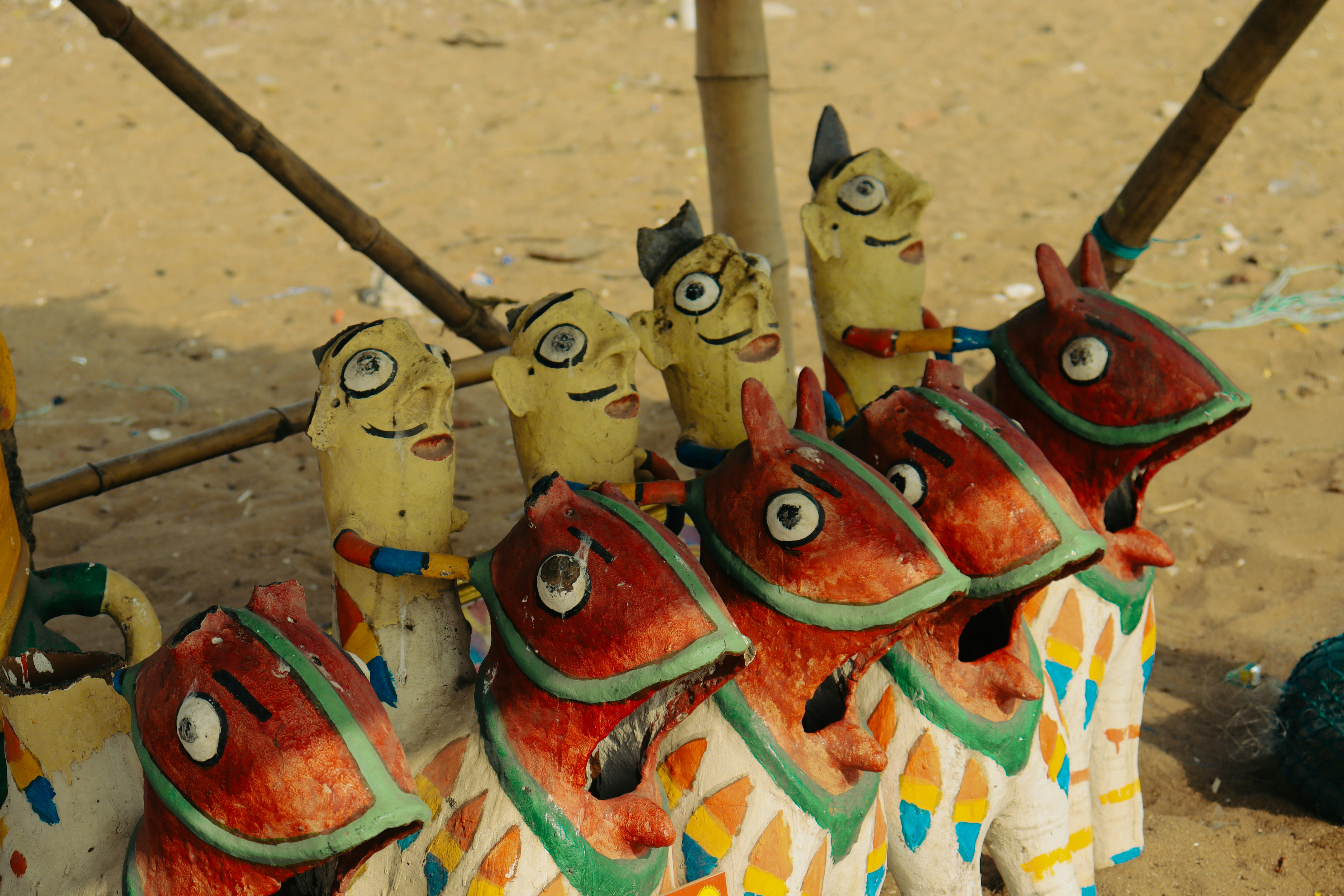 Whimsical Parade: Painted Pinheads Watch the Beach
