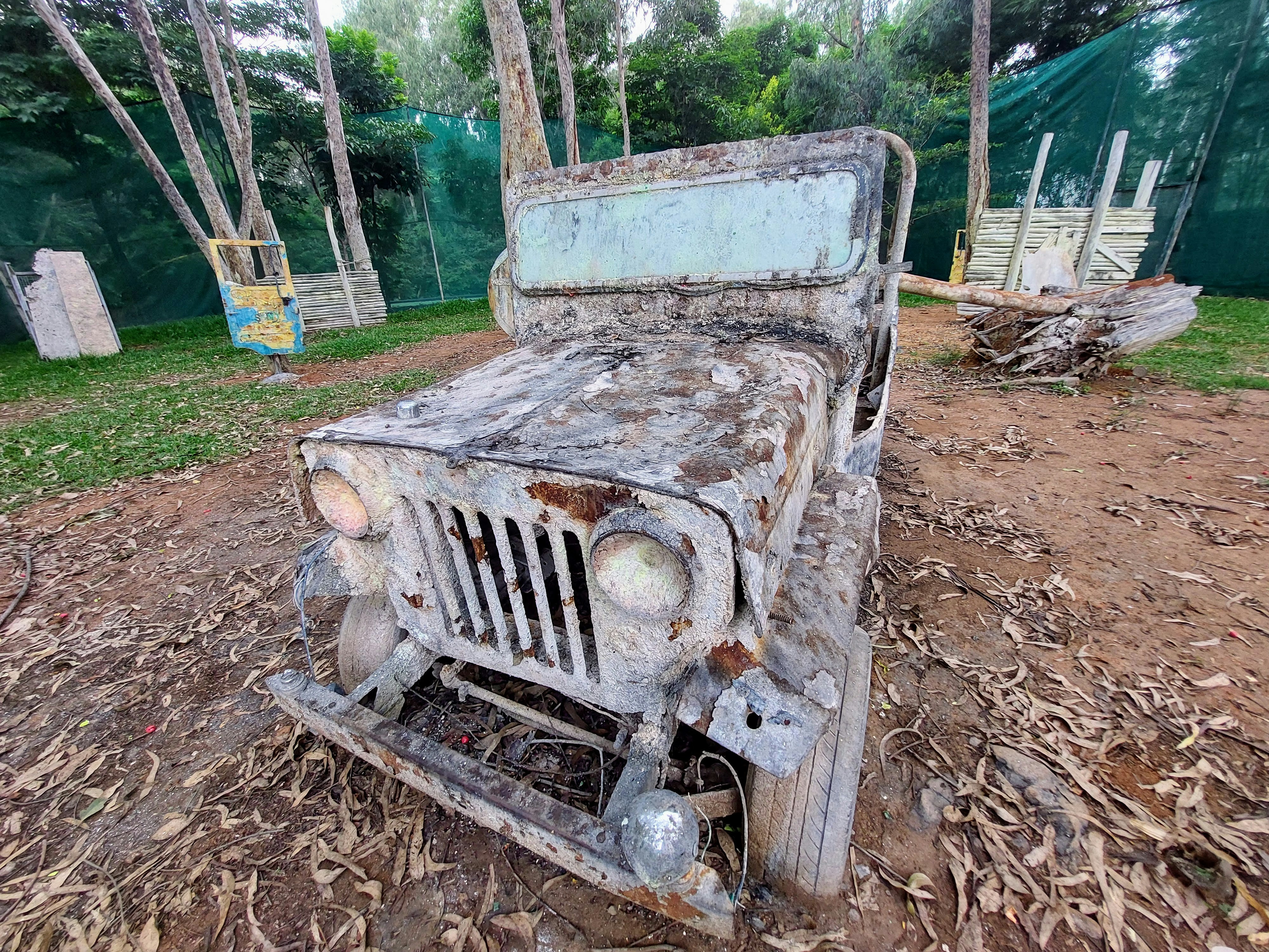 Timeworn Jeep Sentinel in a Leaf-Littered Park