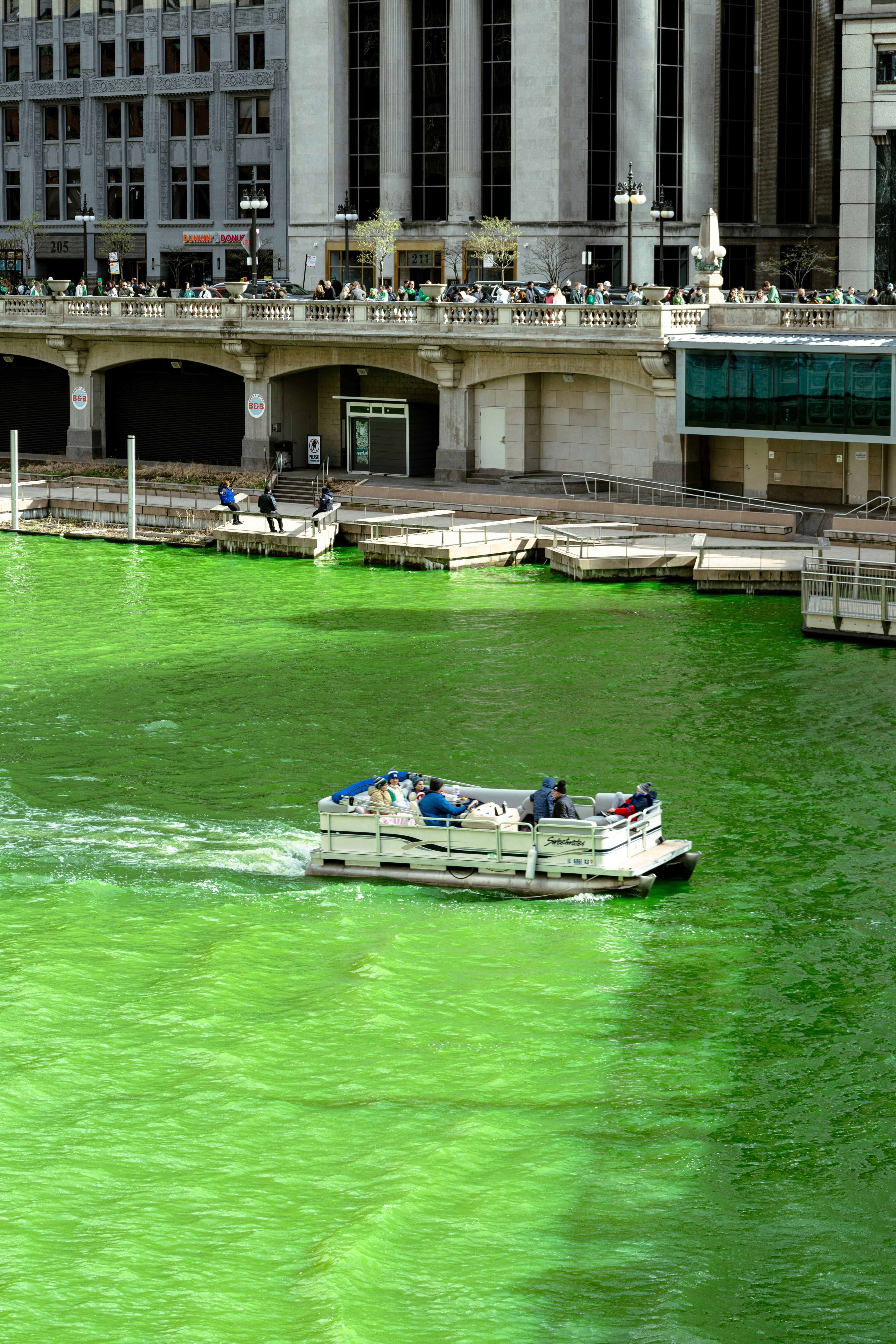 A boat in a body of green water photo – Free Chicago Image on Unsplash
