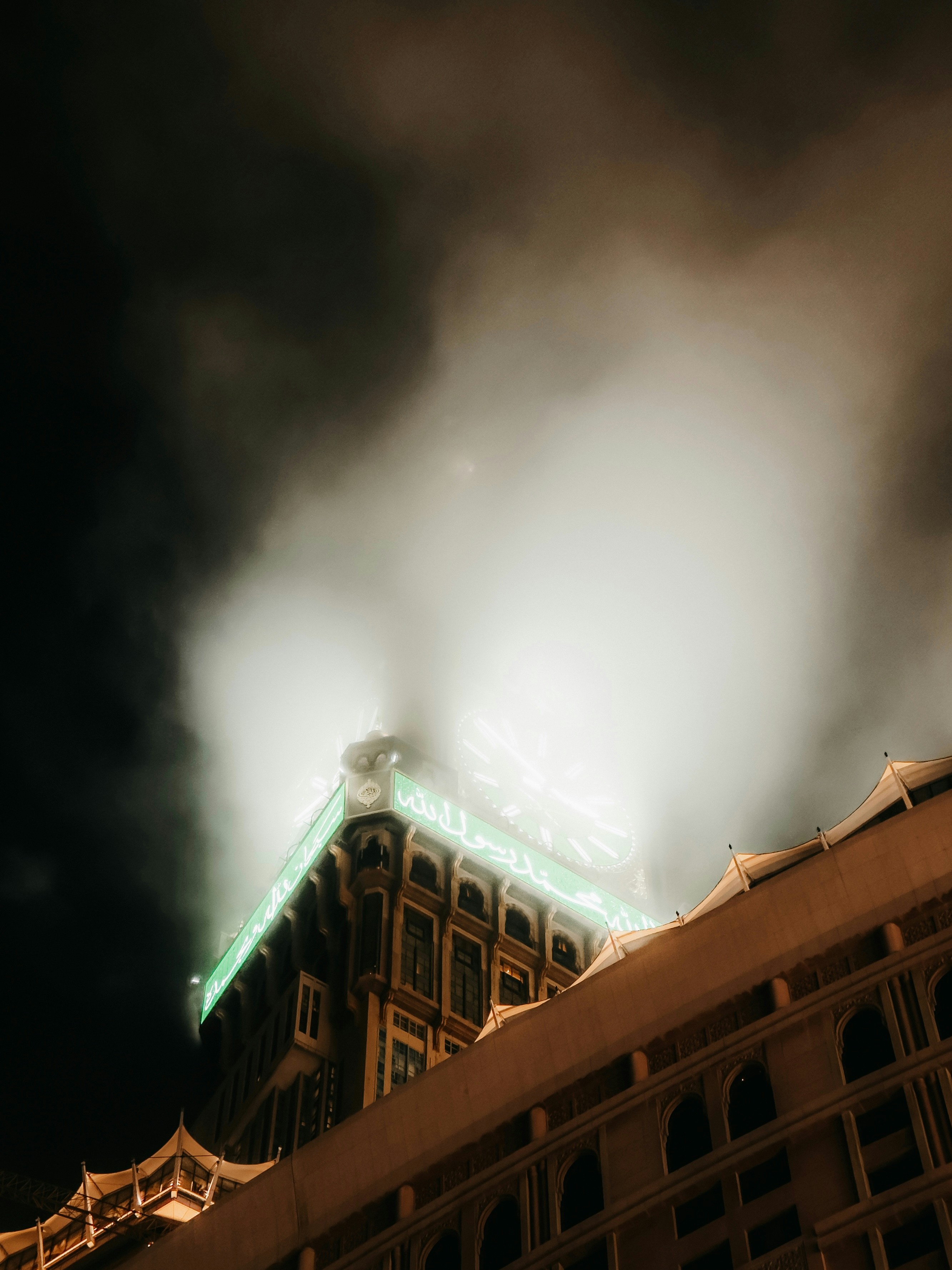 Green Neon Summit Shrouded in Night Fog