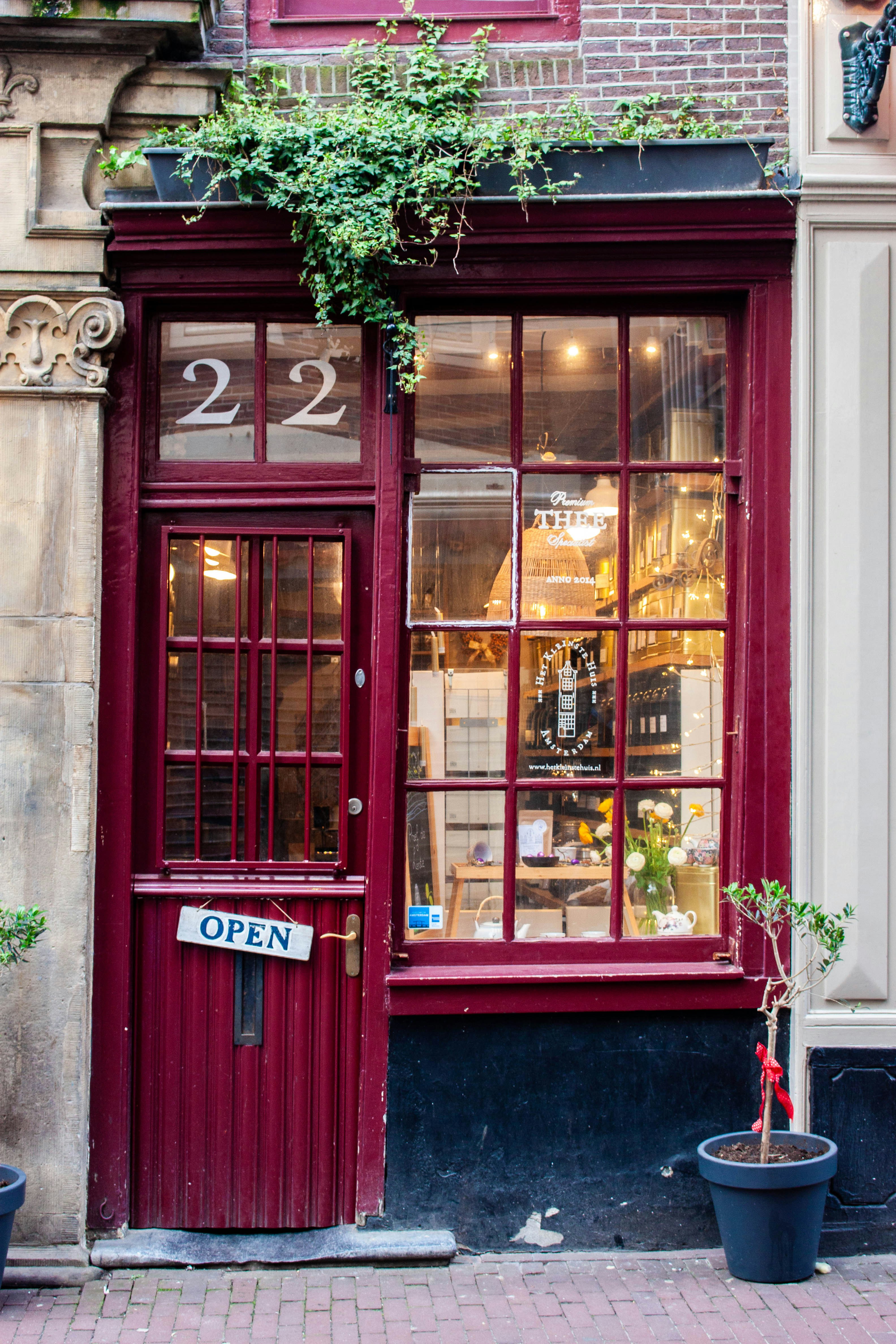 A store front with a red door and window photo – Free Building Image on ...