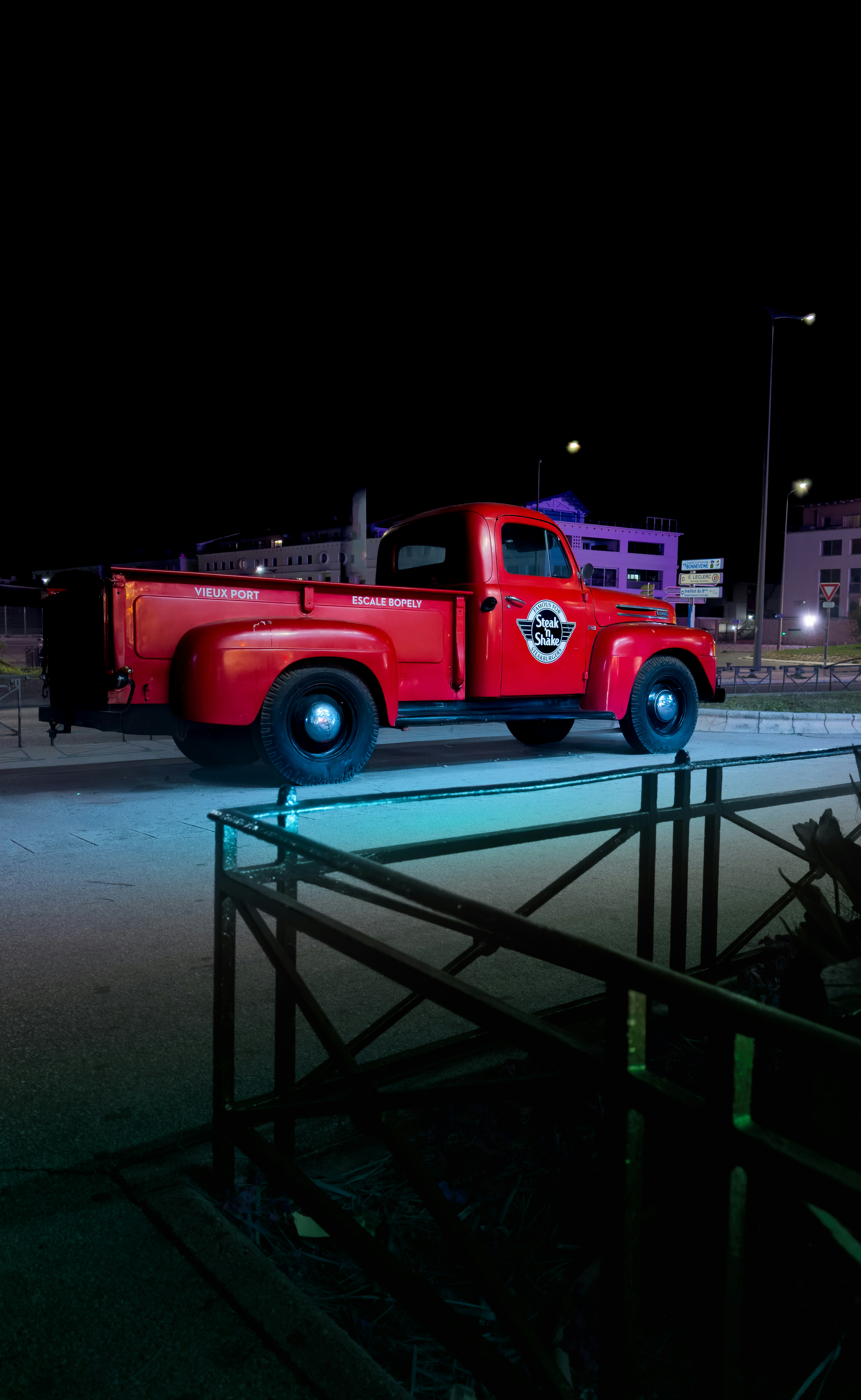 Crimson Vintage Truck Bathed in Neon Nightlight