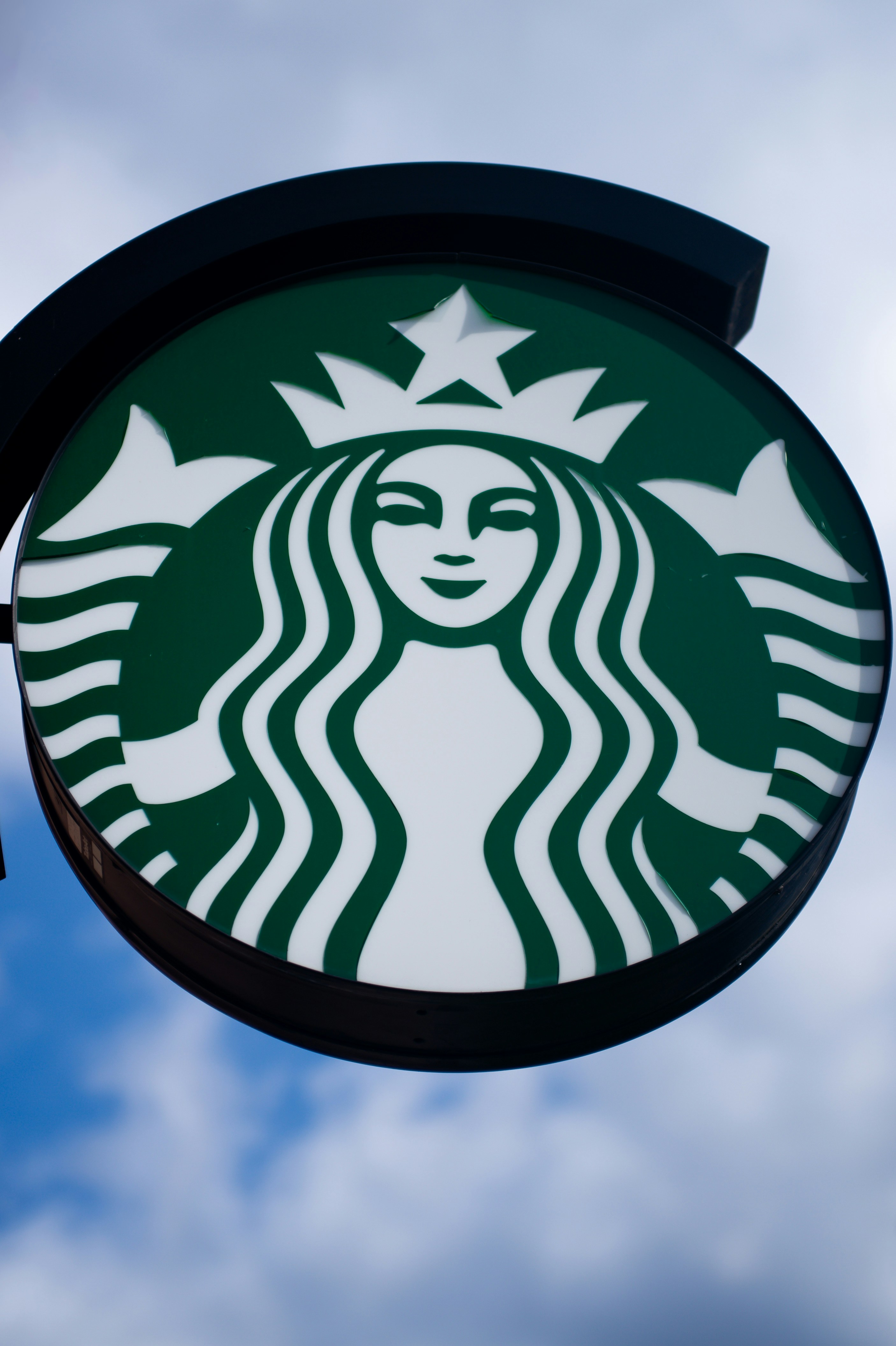 A starbucks sign hanging from the side of a building photo – Free 日本、奈良 ...