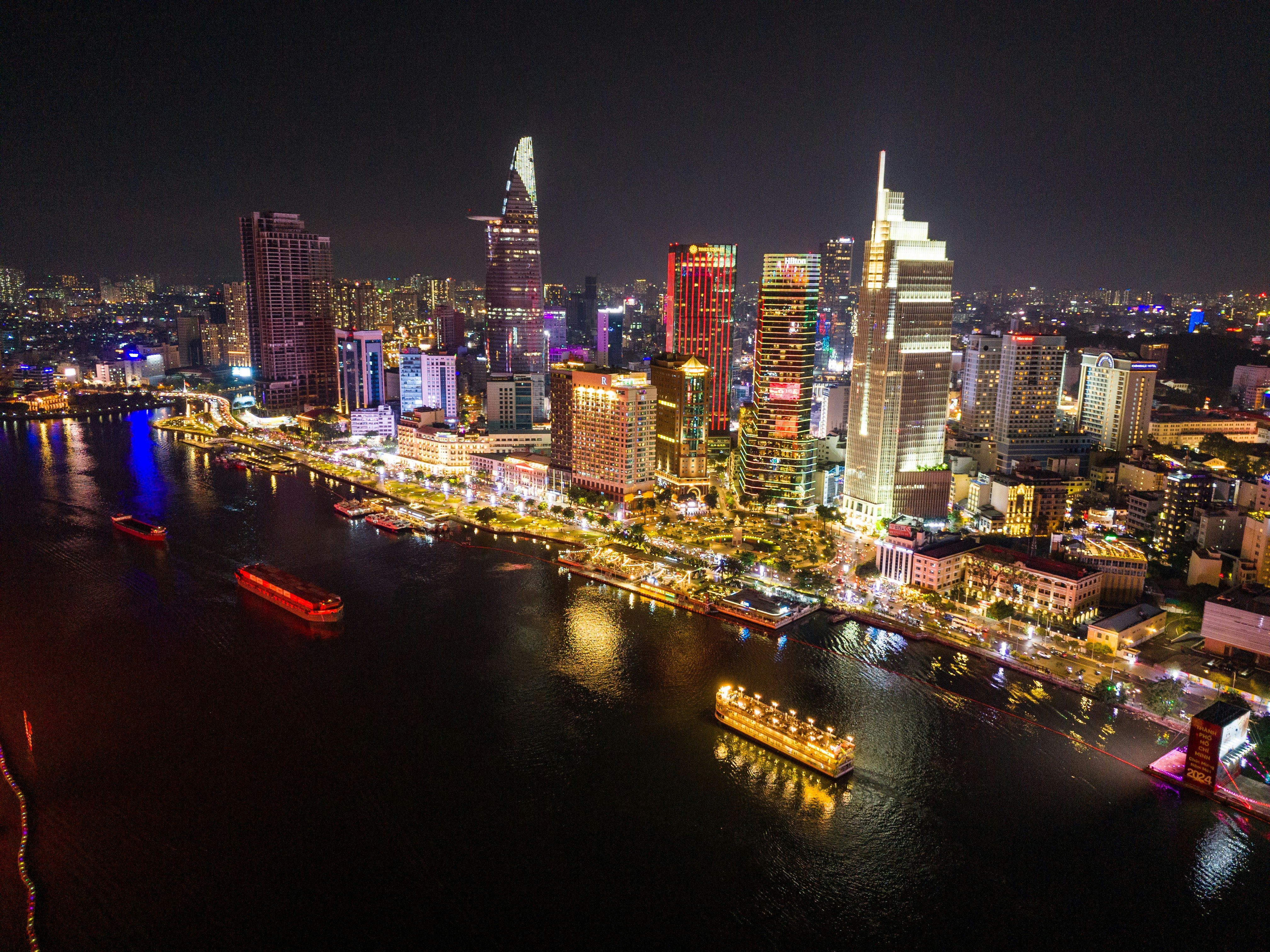 Neon Grid Over Water: Nighttime City Skyline